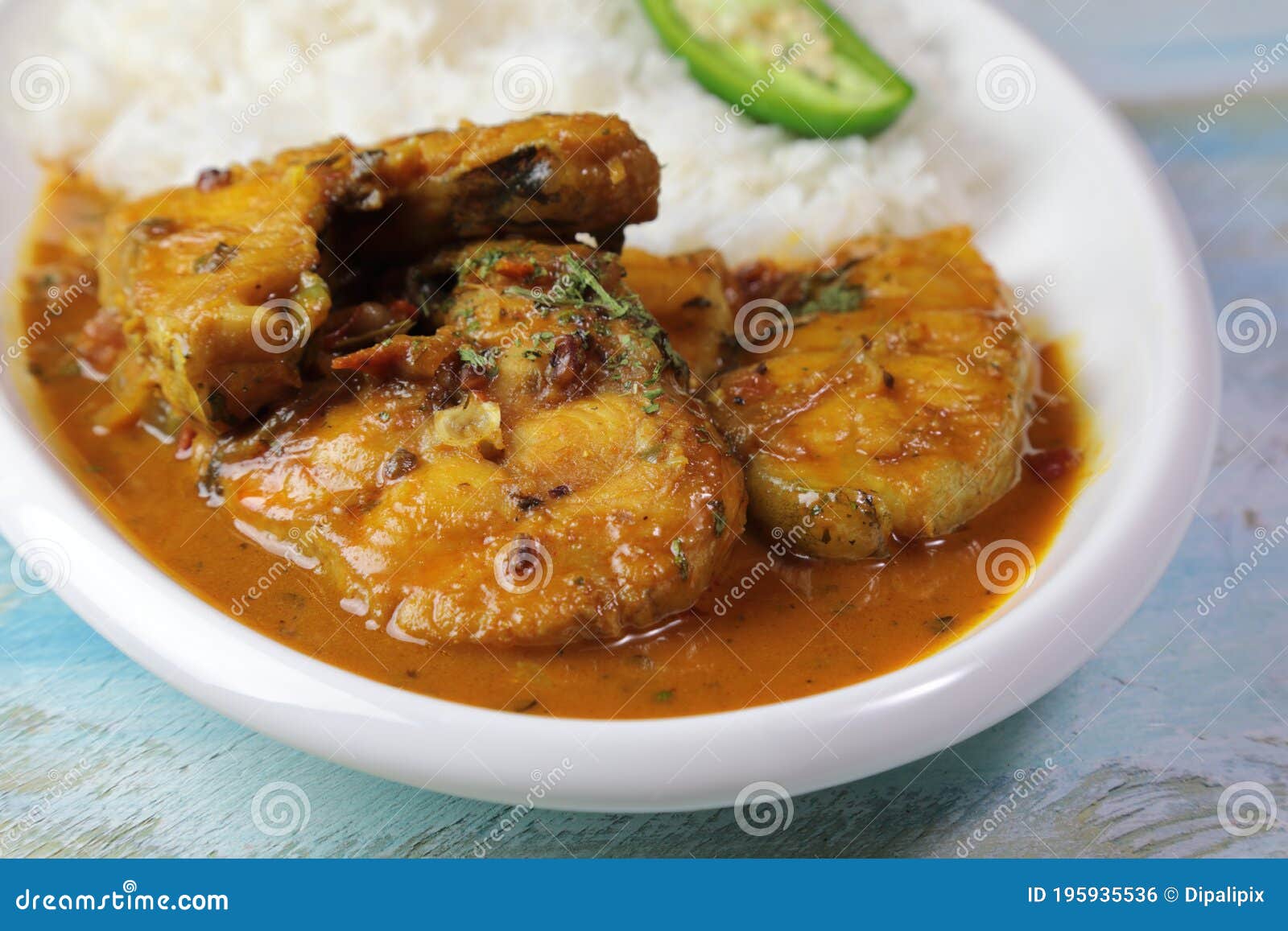 A Platter of North Indian Style Fish Curry with Rice Stock Photo ...