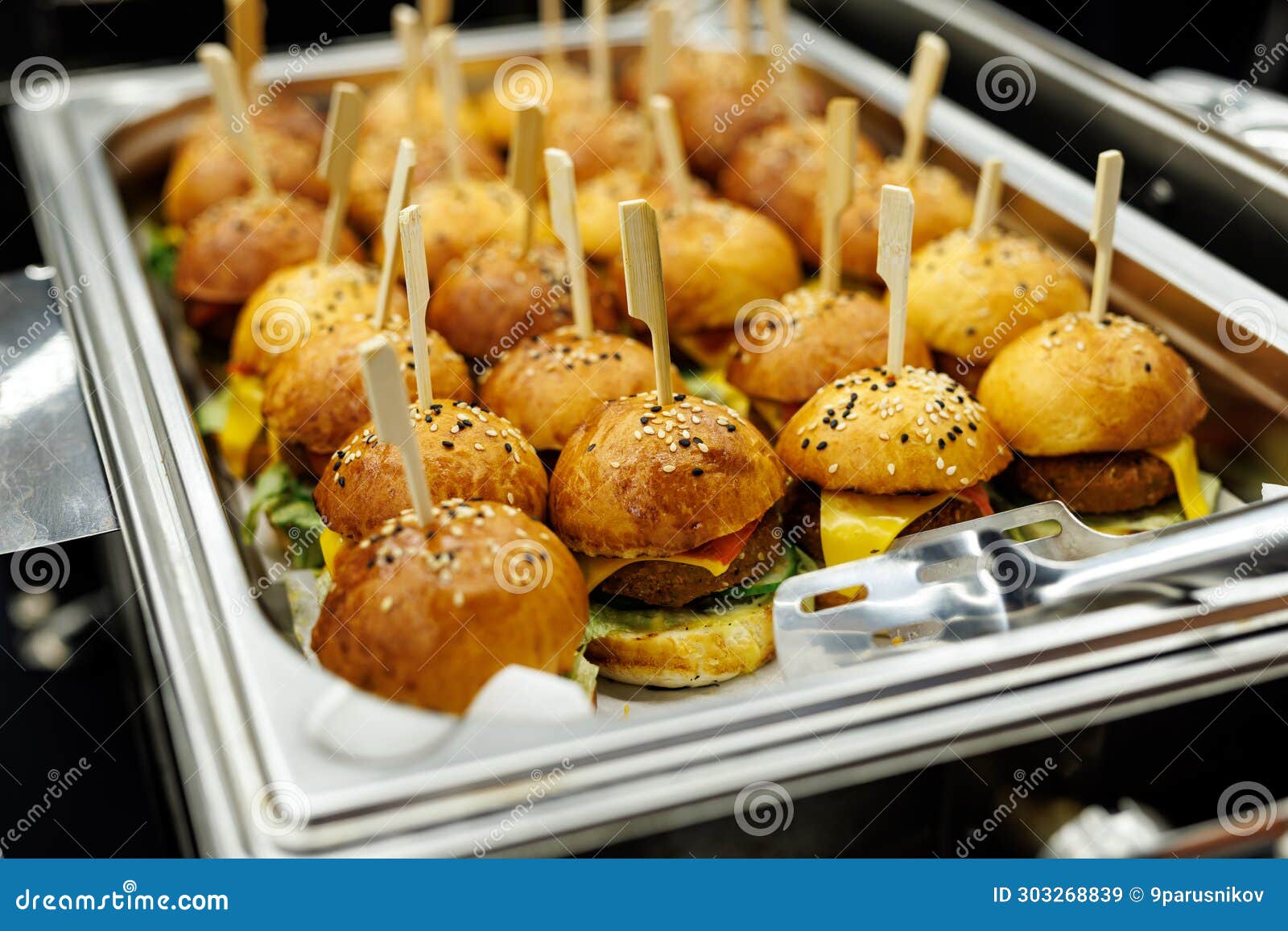 A Platter of Savory Mini Burgers with Toothpicks and Condiments Stock ...