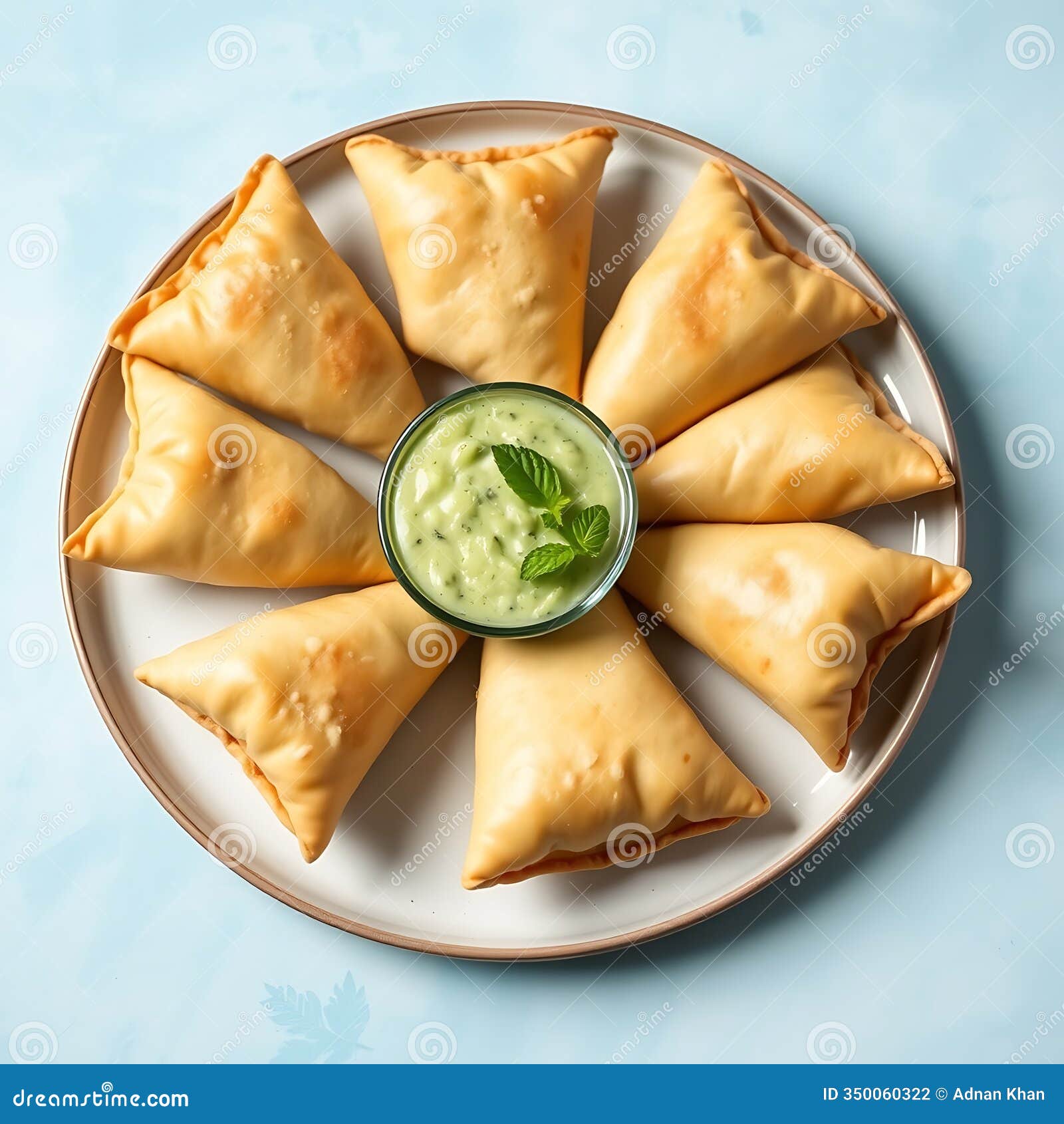 A Platter of Vegetable Samosas with Mint Chutney on a Pastel Blue ...