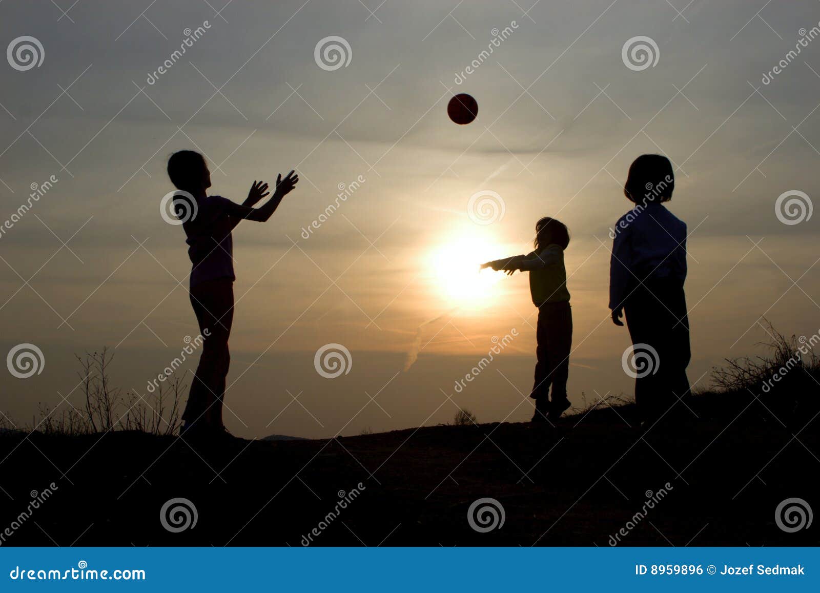 Play of children in sunset stock photo. Image of silhouette - 8959896