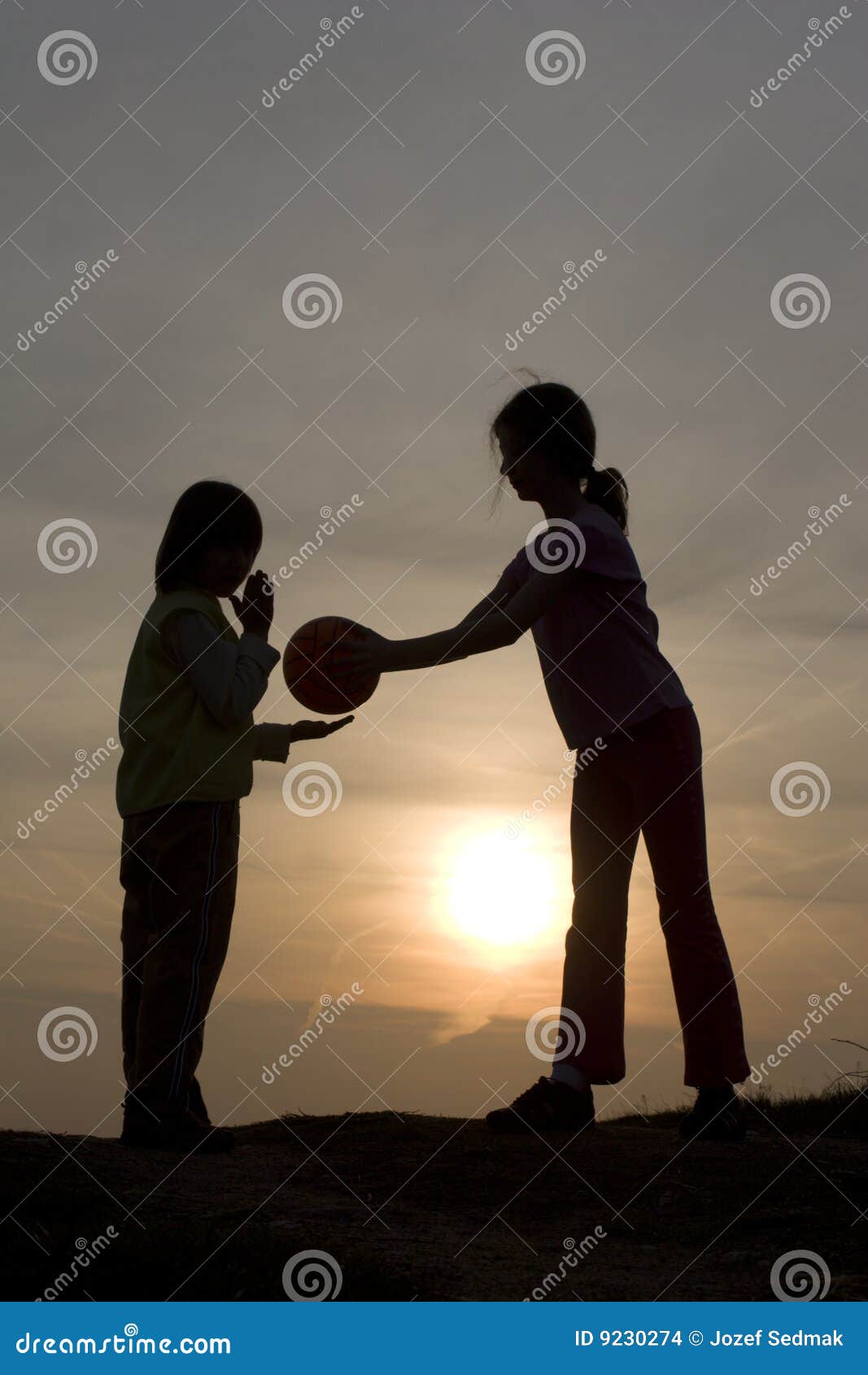 Play of children in sunset stock photo. Image of silhouette - 9230274