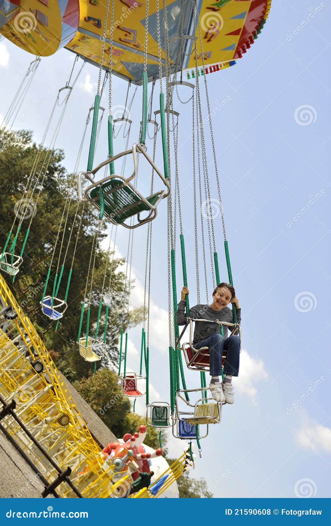 Play on the merry-go-round stock photo. Image of person - 21590608