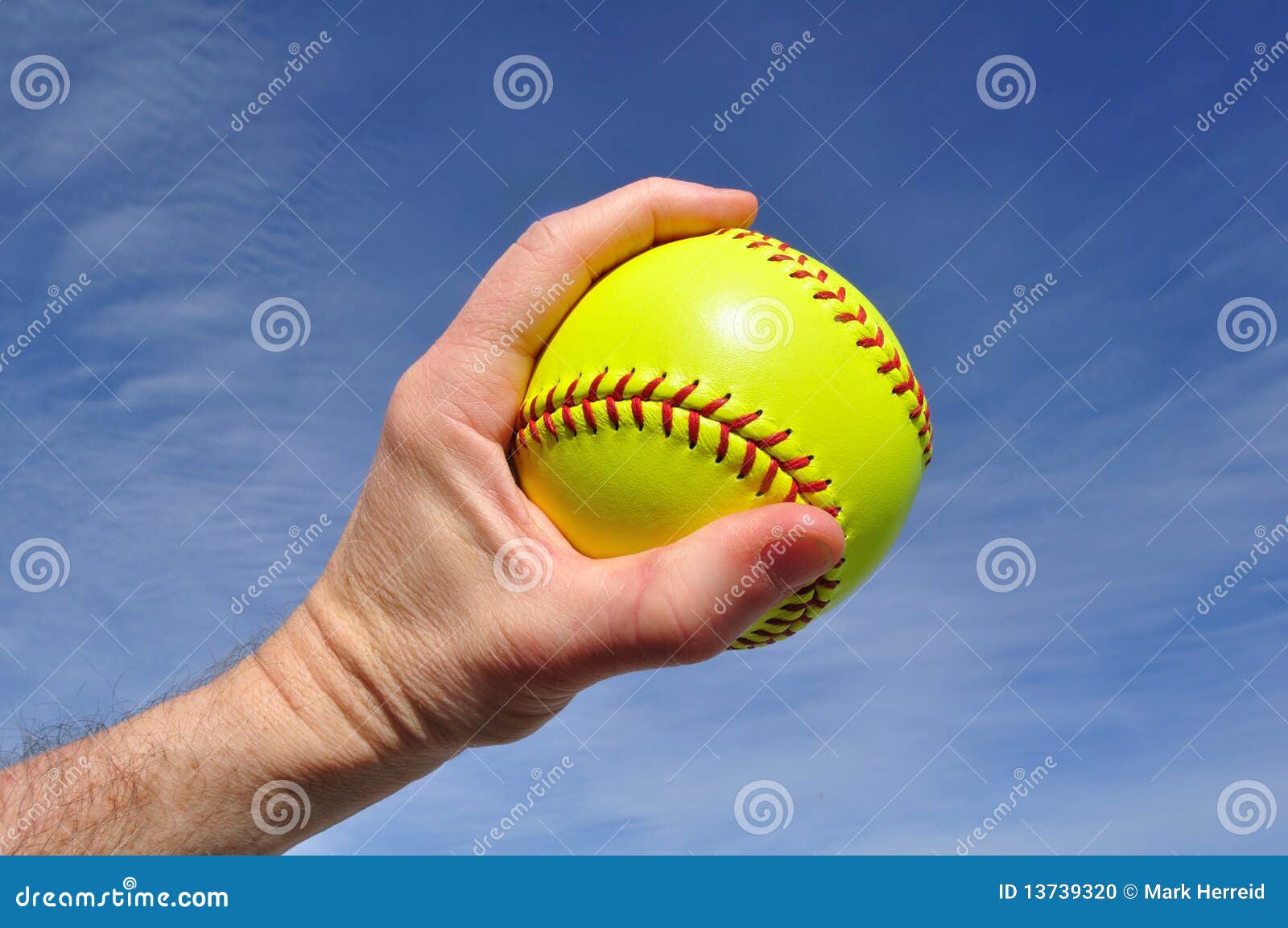 Player Gripping a Yellow Softball Stock Photo - Image of grip, sport ...