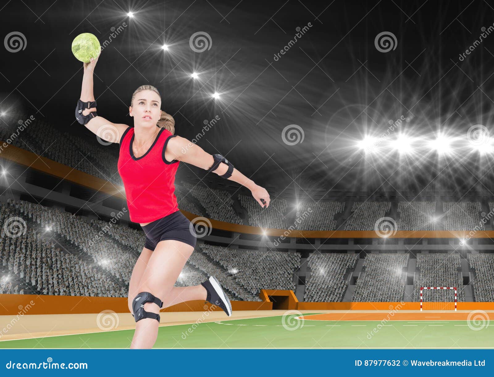 Player Playing Handball in Stadium Stock Photo - Image of field, effort ...