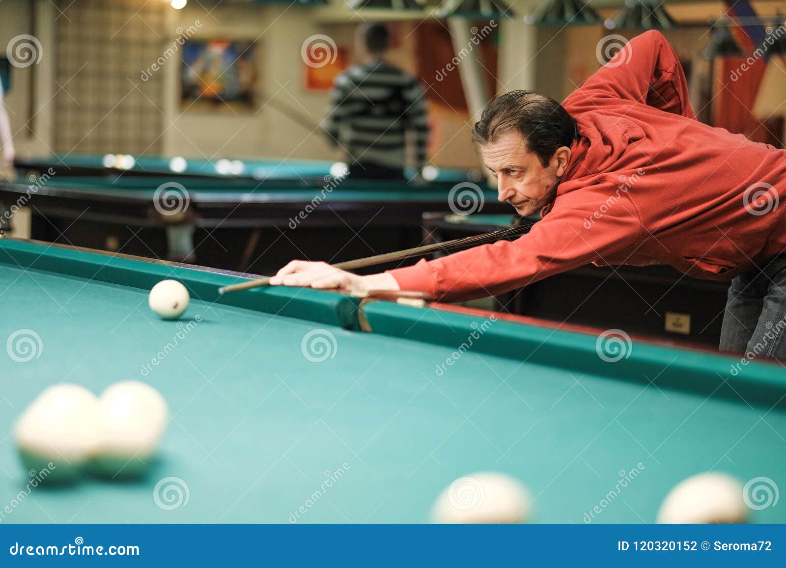 The Player Takes Aim at the Ball in Billiards Stock Photo - Image of ...