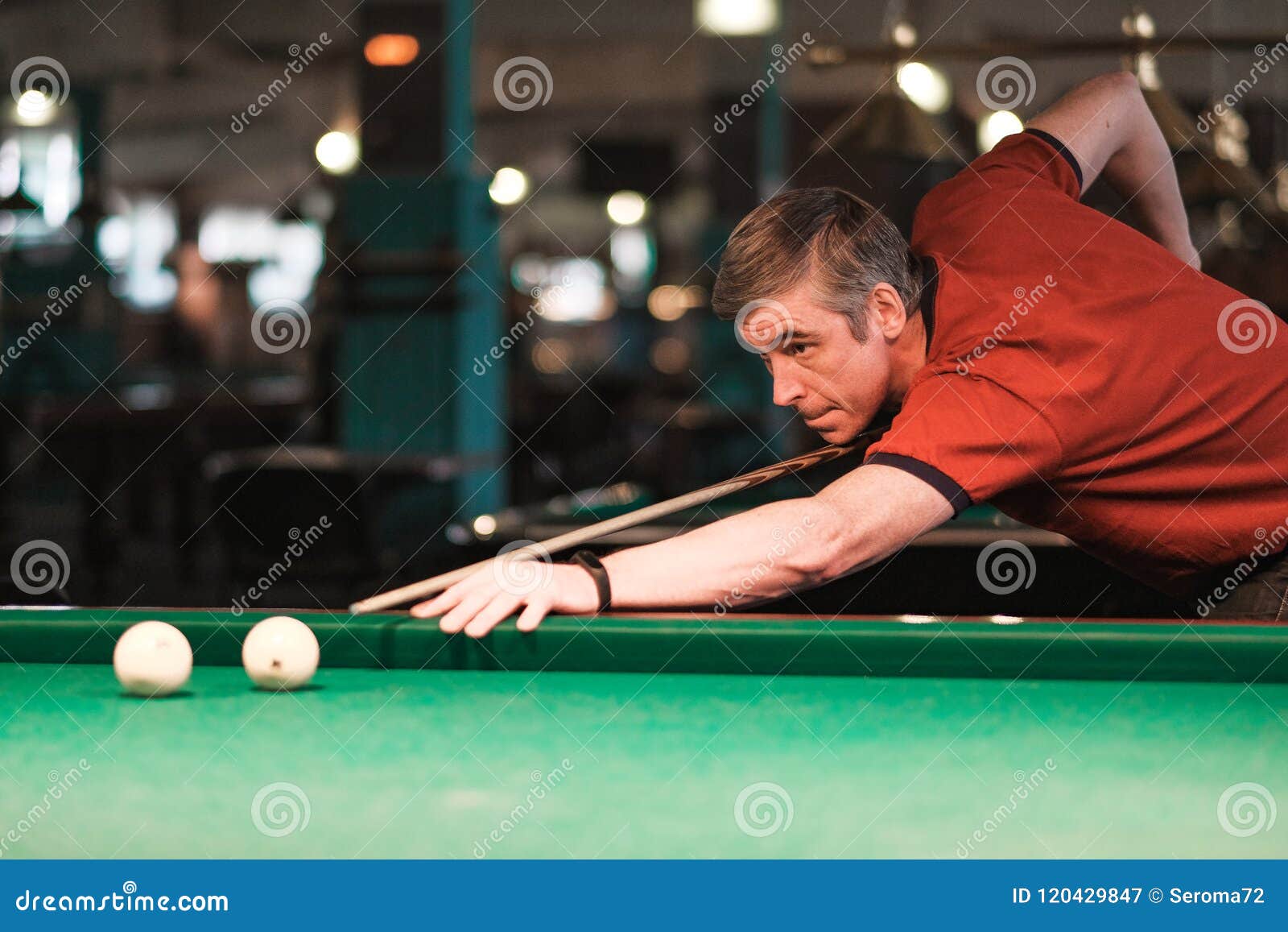 The Player Takes Aim at the Ball in Billiards Stock Image - Image of ...