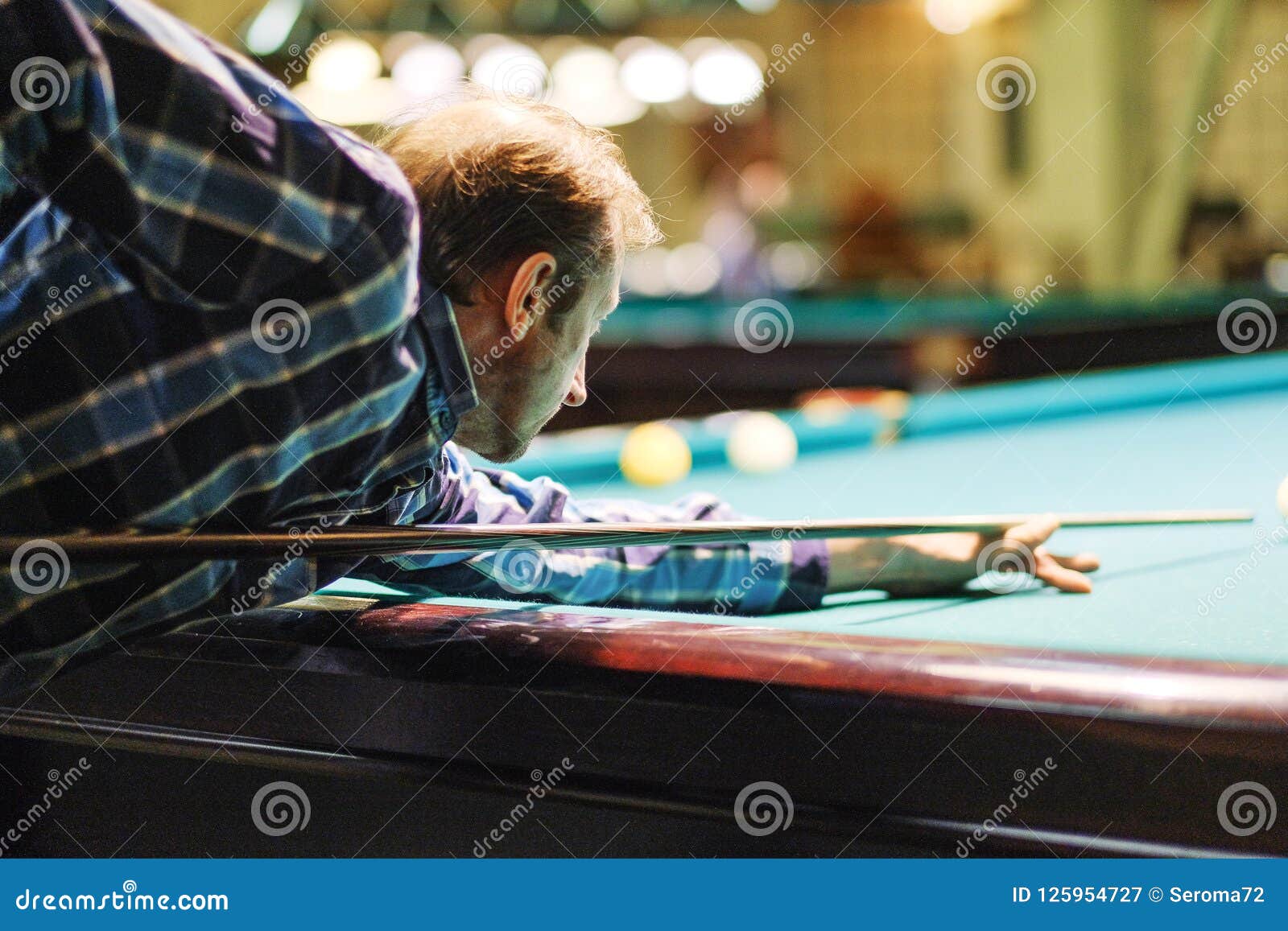 The Player Takes Aim at the Ball in Billiards Stock Image - Image of ...
