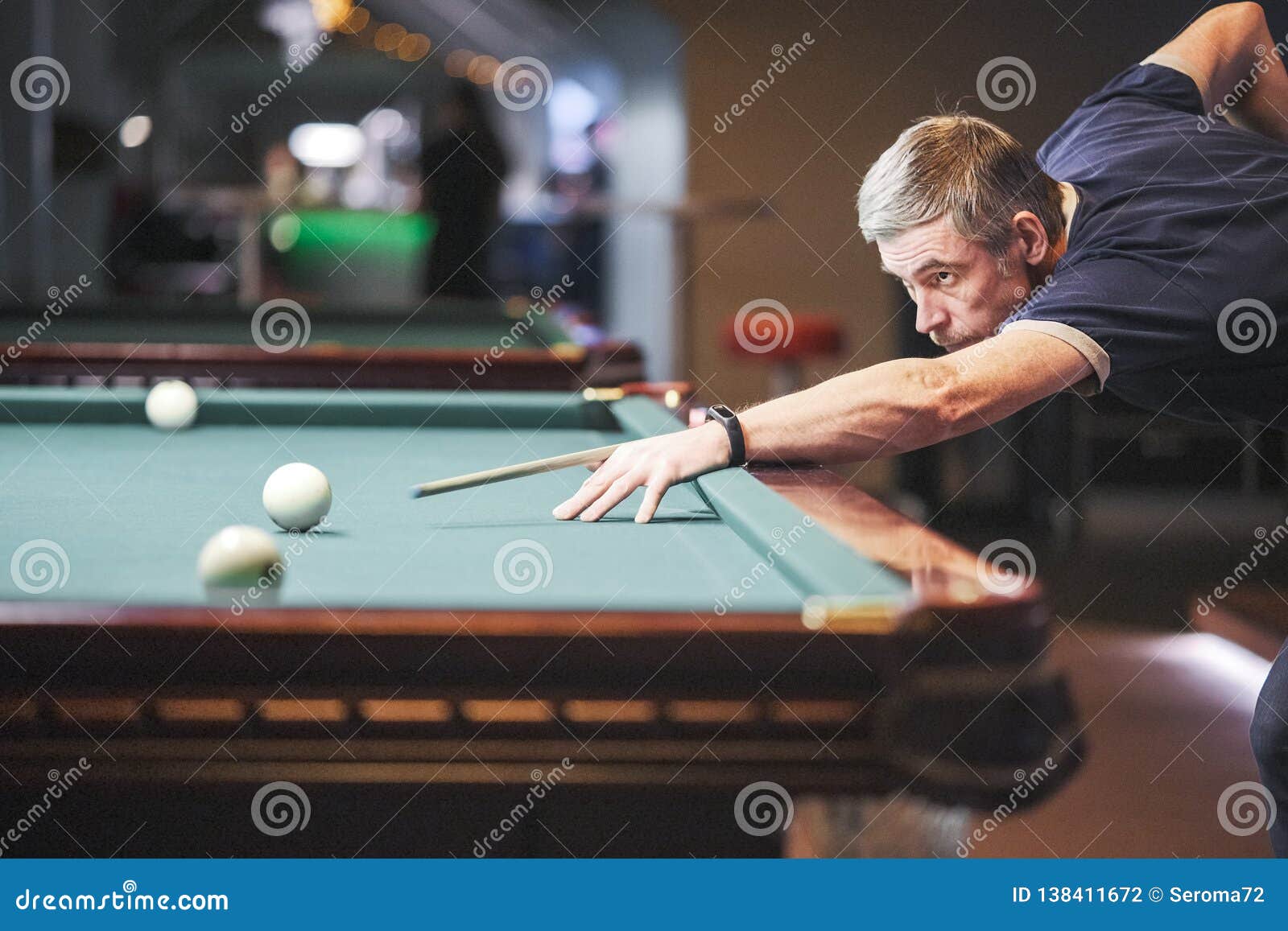 The Player Takes Aim at the Ball in Billiards Stock Photo - Image of ...
