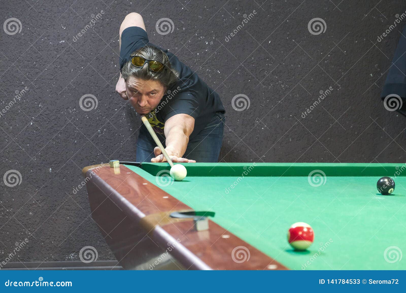 The Player Takes Aim at the Ball in Billiards Stock Image - Image of ...