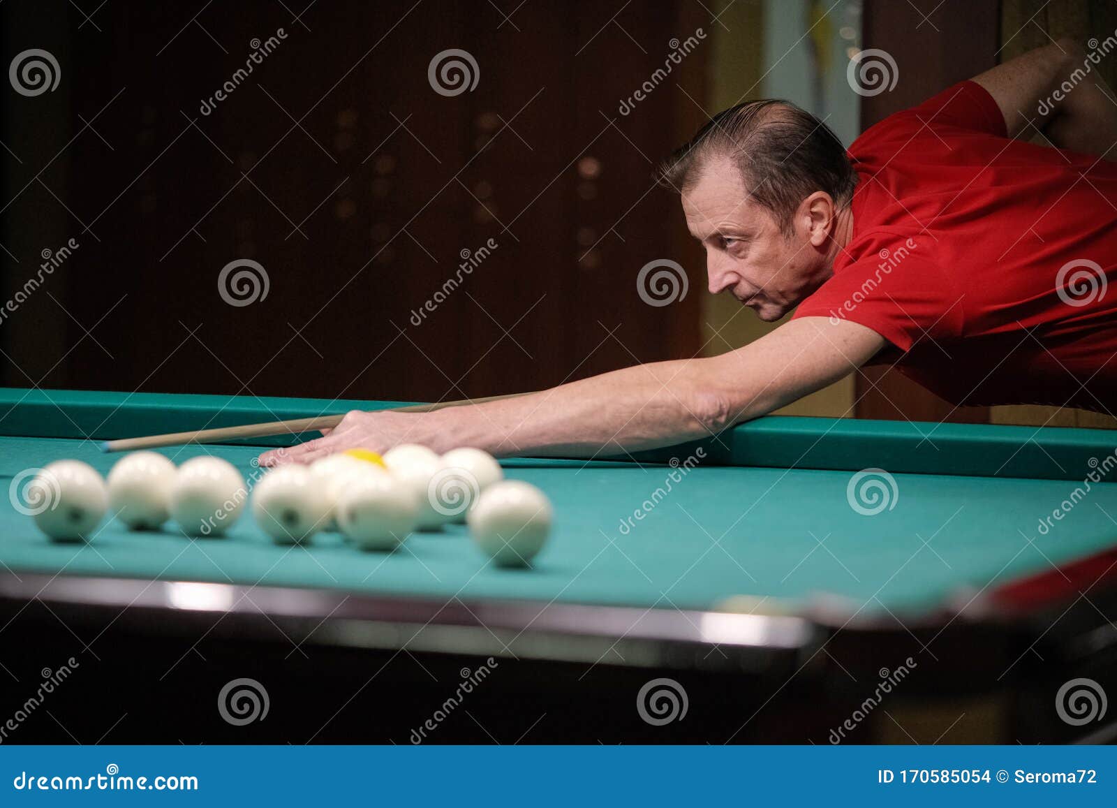 The Player Takes Aim at the Ball in Billiards Stock Photo - Image of ...