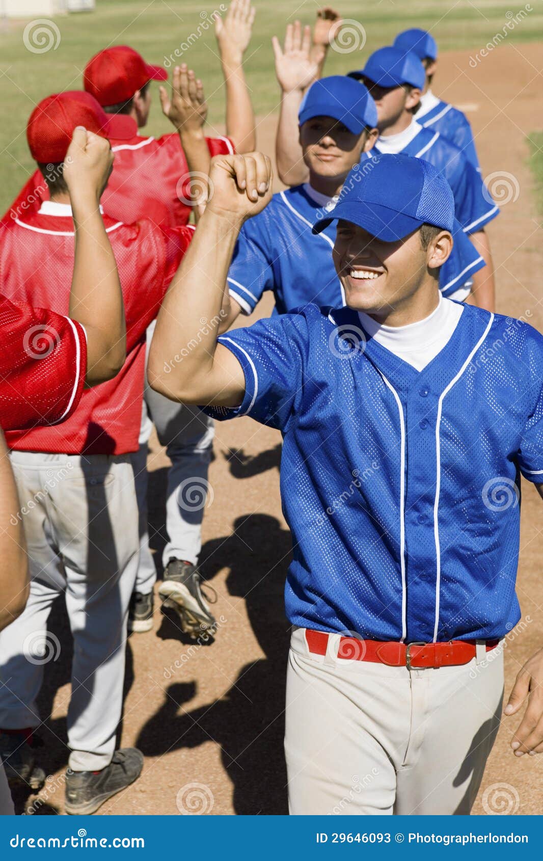 Players Giving a High-Five stock image. Image of smile - 29646093