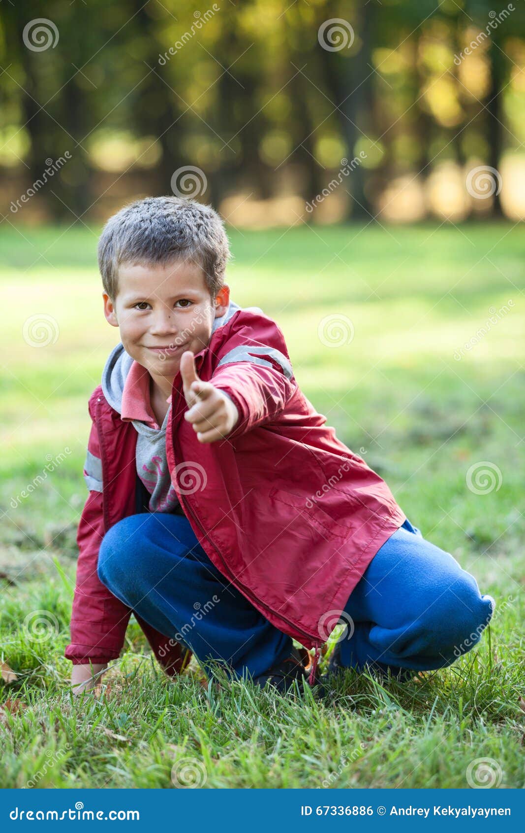 Playful Boy Shooting with Finger at Camera Stock Photo - Image of park ...