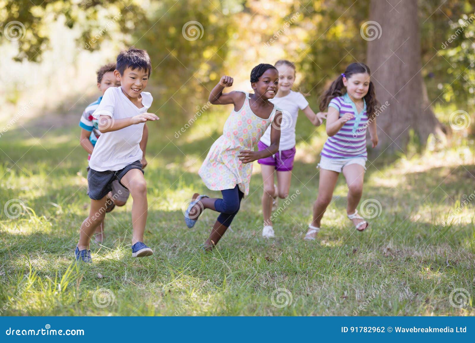 Playful Children Running at Campsite Stock Photo - Image of casual ...