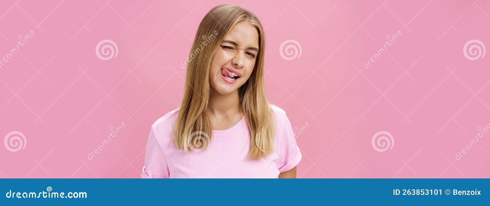 Playful Flirty Attractive Young Girl With Fair Straight Hair In T Shirt