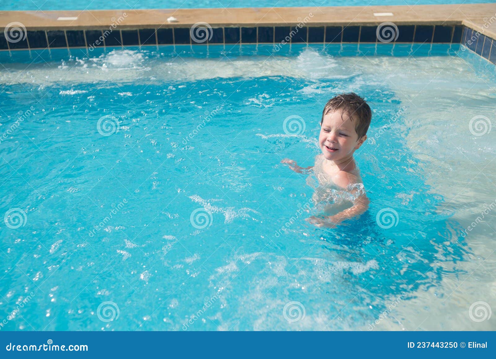 Playful Little Boy Splash in Swimming Pool. Resort Stock Photo - Image ...