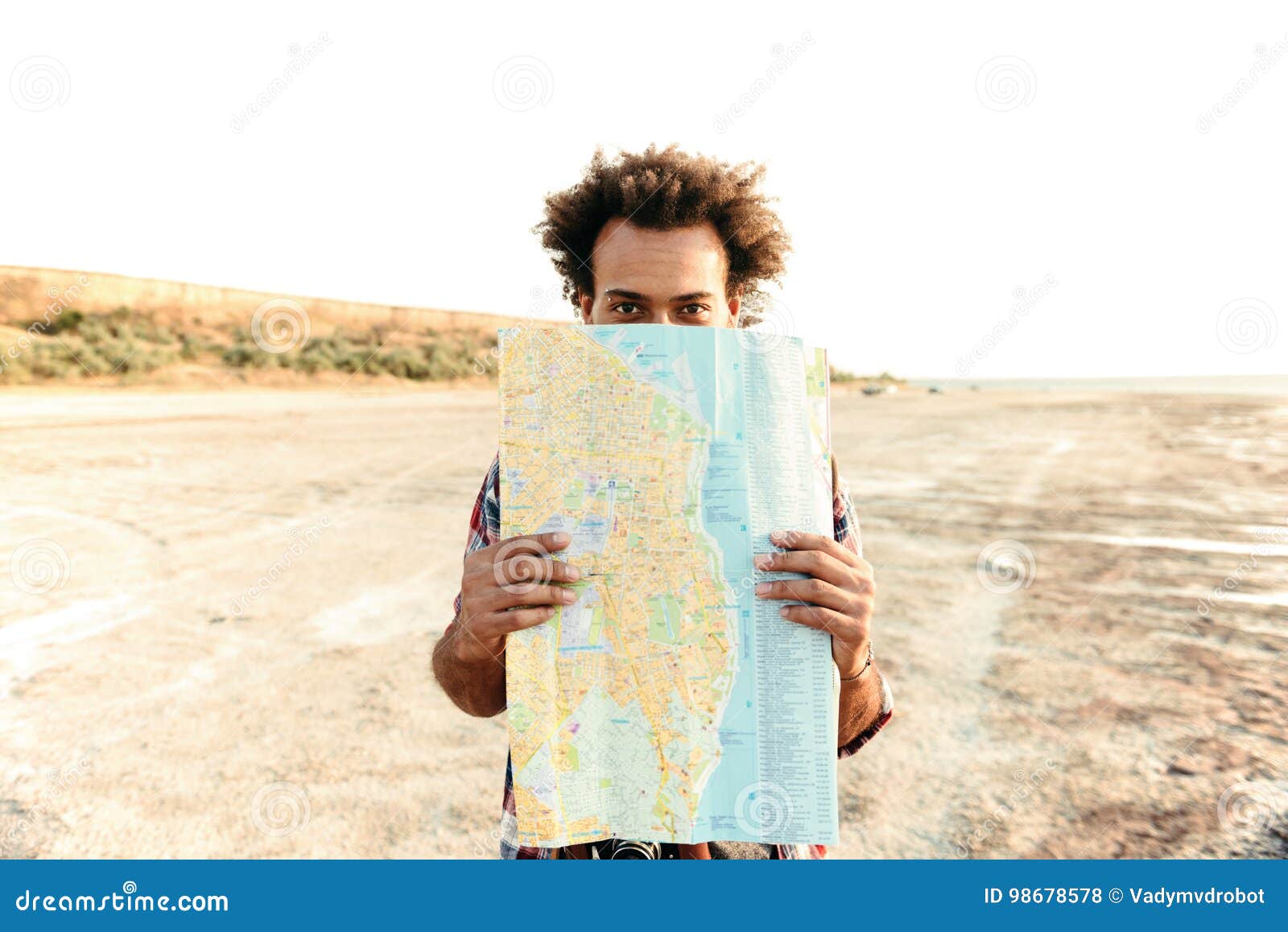 Playful Man Standing and Hiding Behind Map Outdoors Stock Photo - Image ...