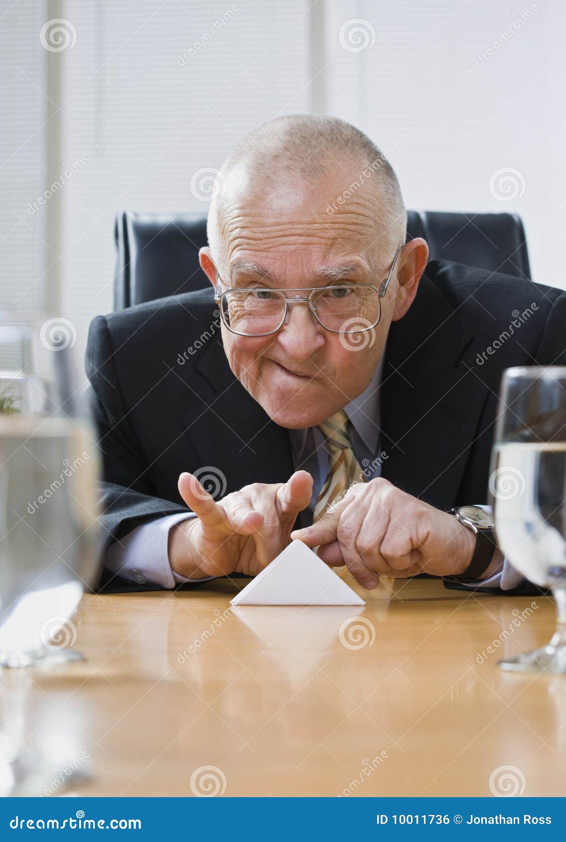 Playful Senior Male Flicking Paper. Stock Photo - Image of business ...
