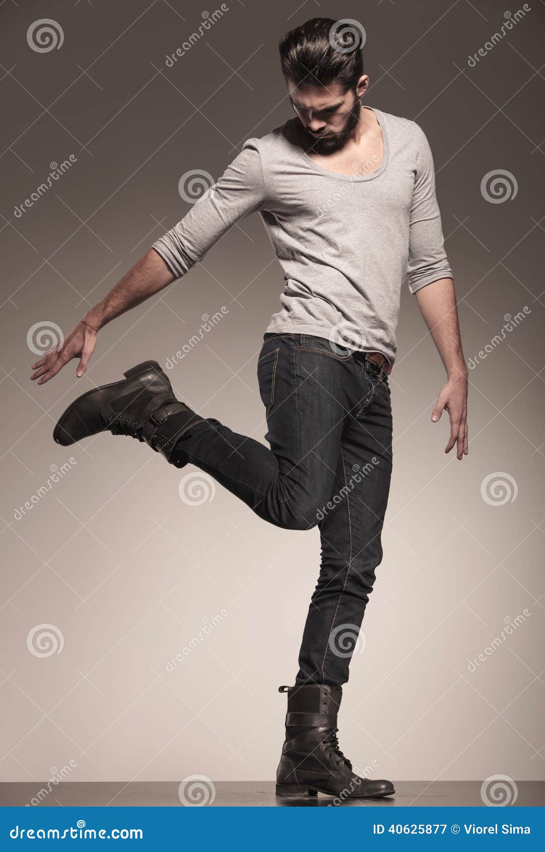 Playful Young Fashion Model in a Dynamic Pose Stock Image - Image of ...