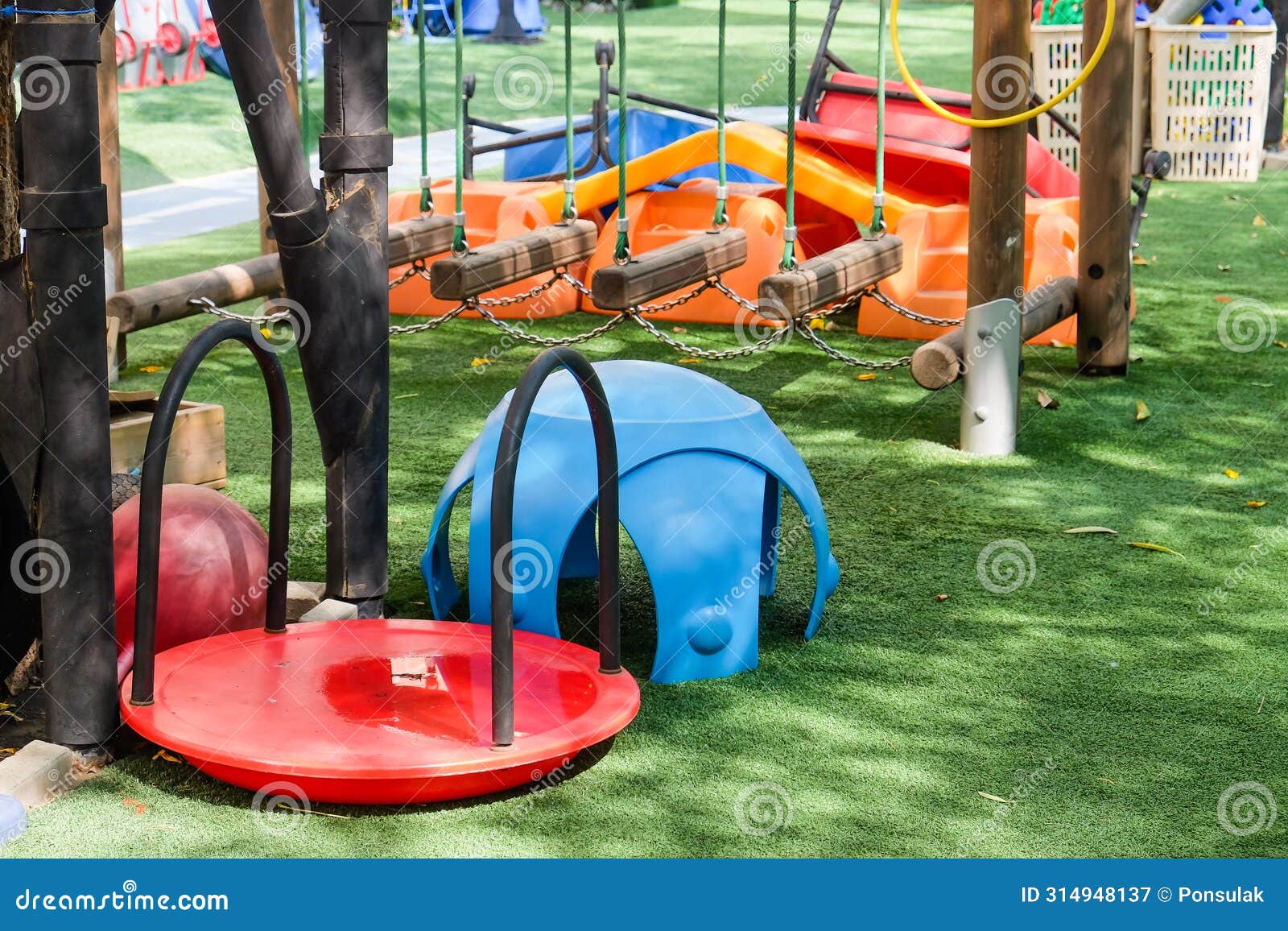 Playground in the Park with Blue and Red Seats and Swings. Stock Image ...