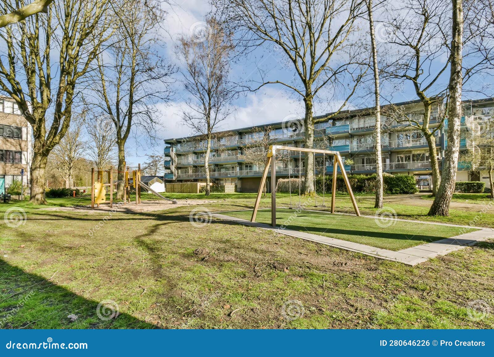 A Playground in a Park in Front of a Building Stock Photo - Image of ...