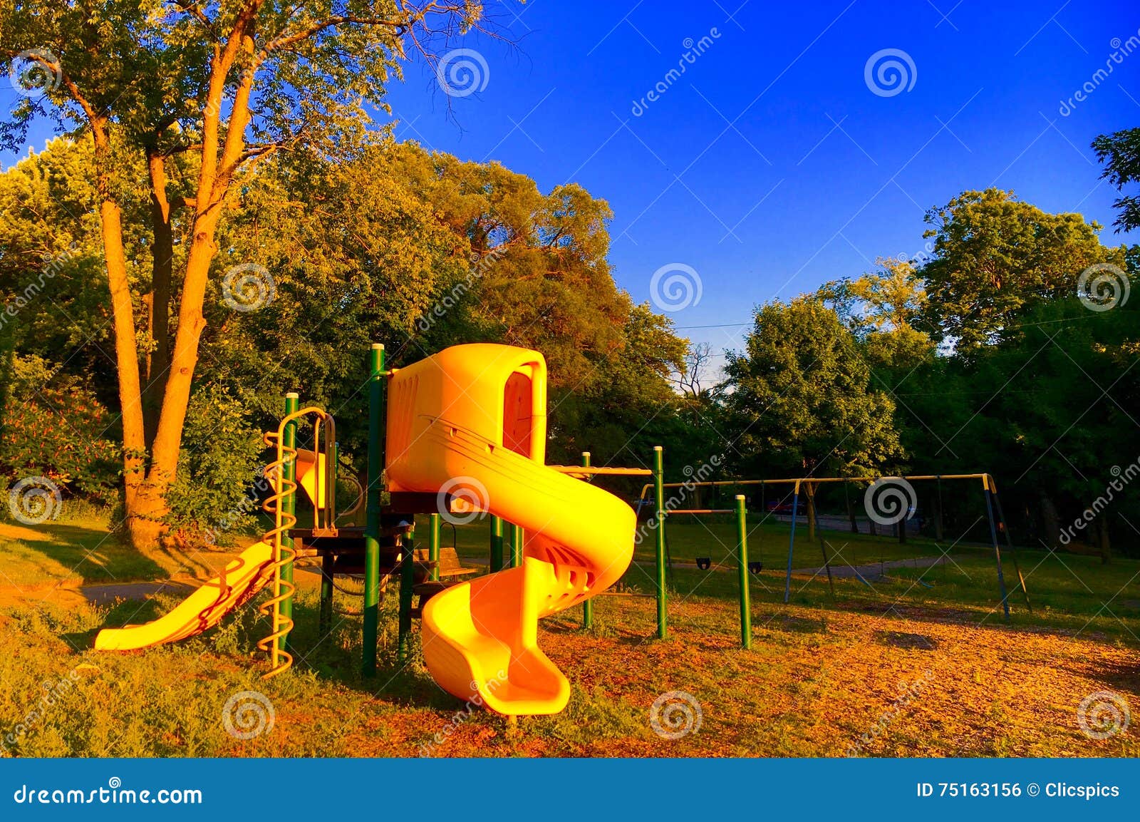 Playground at Sunset stock photo. Image of woodchips - 75163156