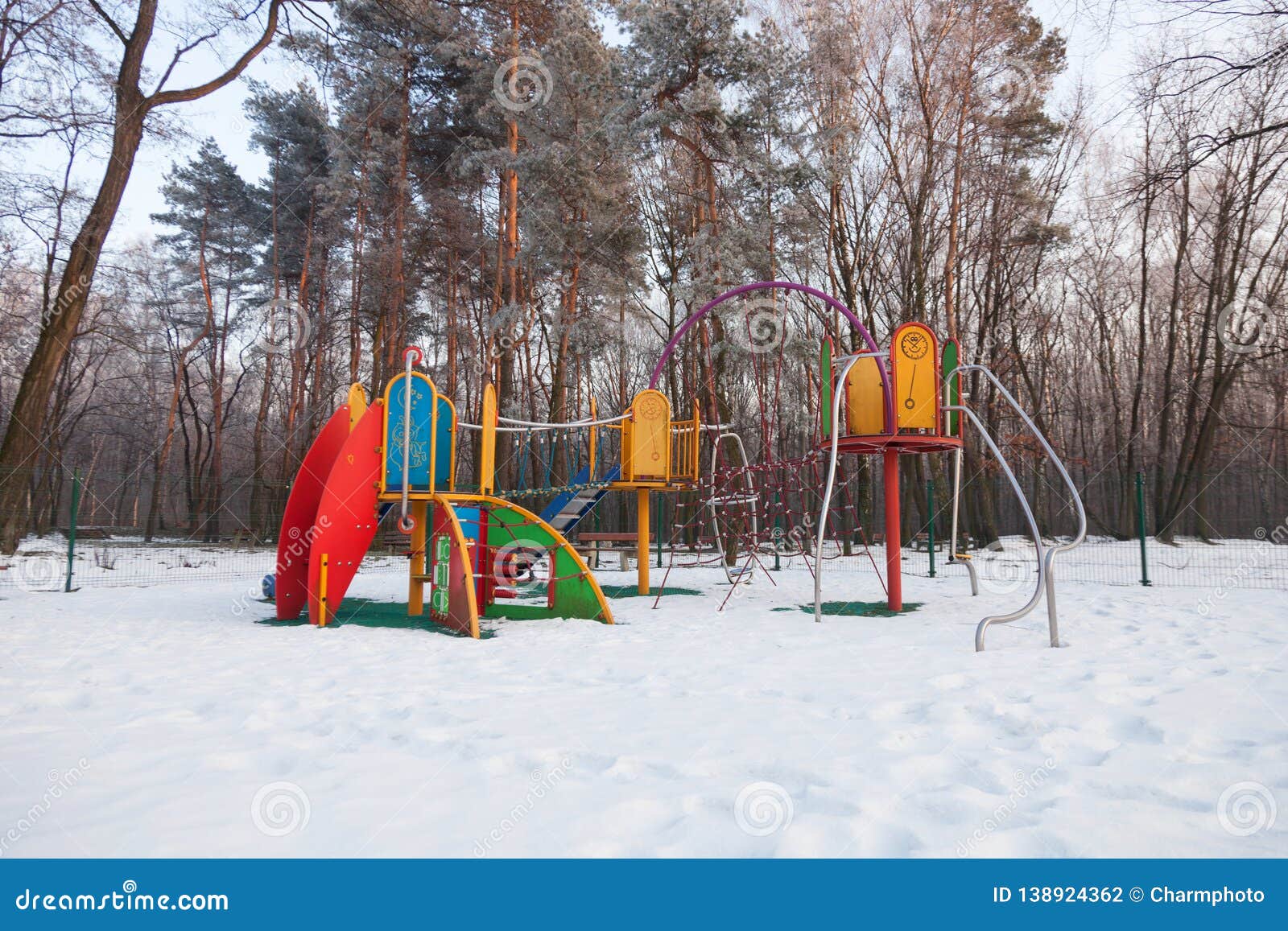 A playground in winter stock photo. Image of white, slides - 138924362