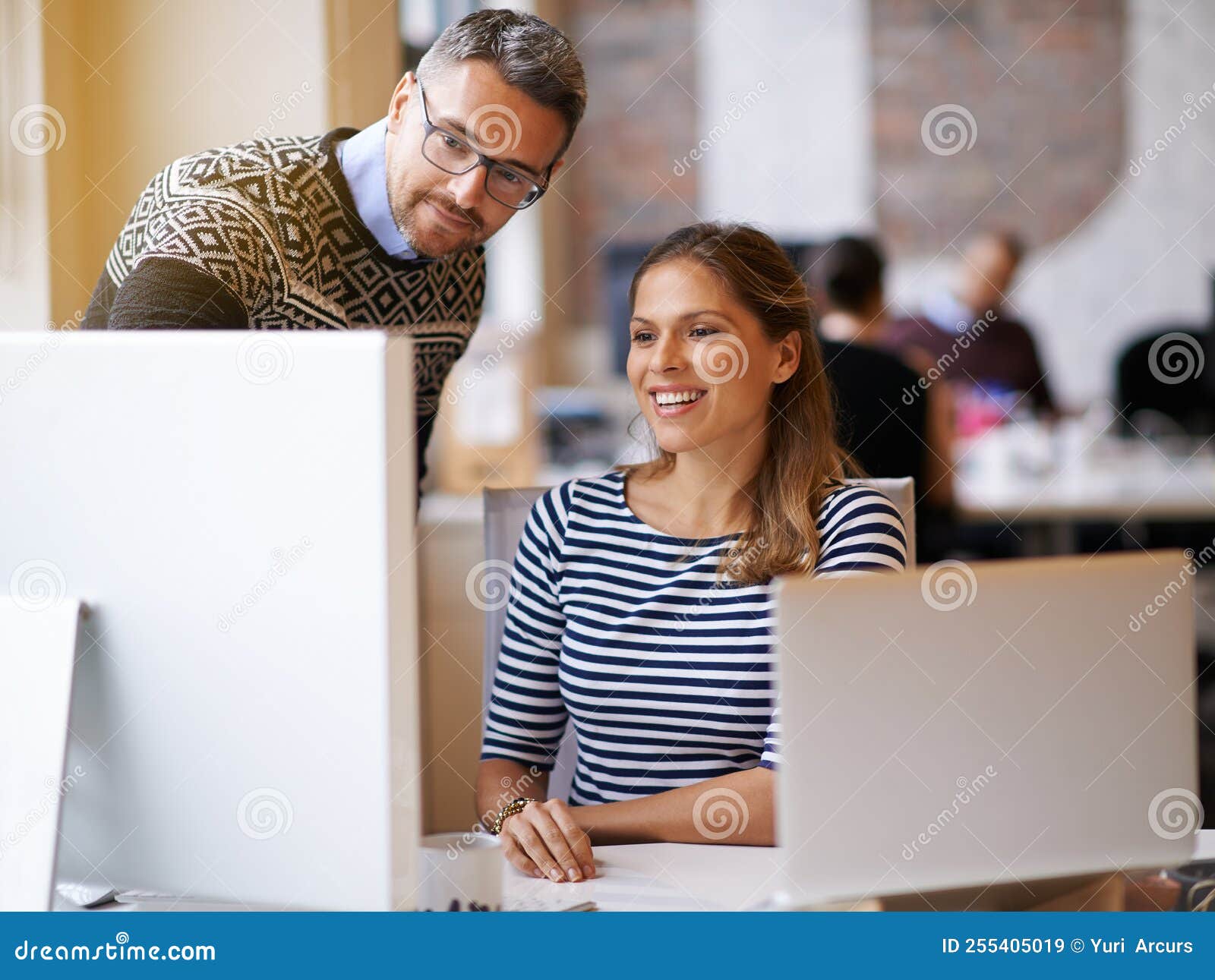 Playing Around with Different Designs. Two Designers Working Together ...