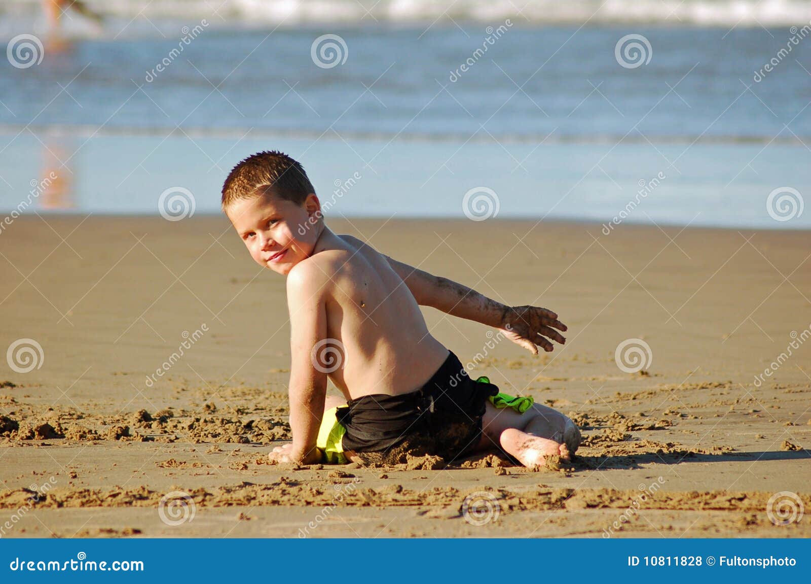 Playing in beach sand stock photo. Image of sand, travel - 10811828