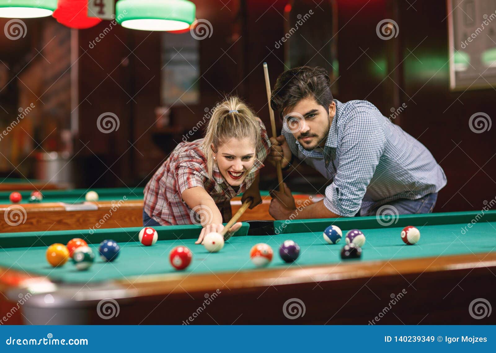 Playing Billiards- Couple Shooting Pool Ball Stock Image - Image of ...