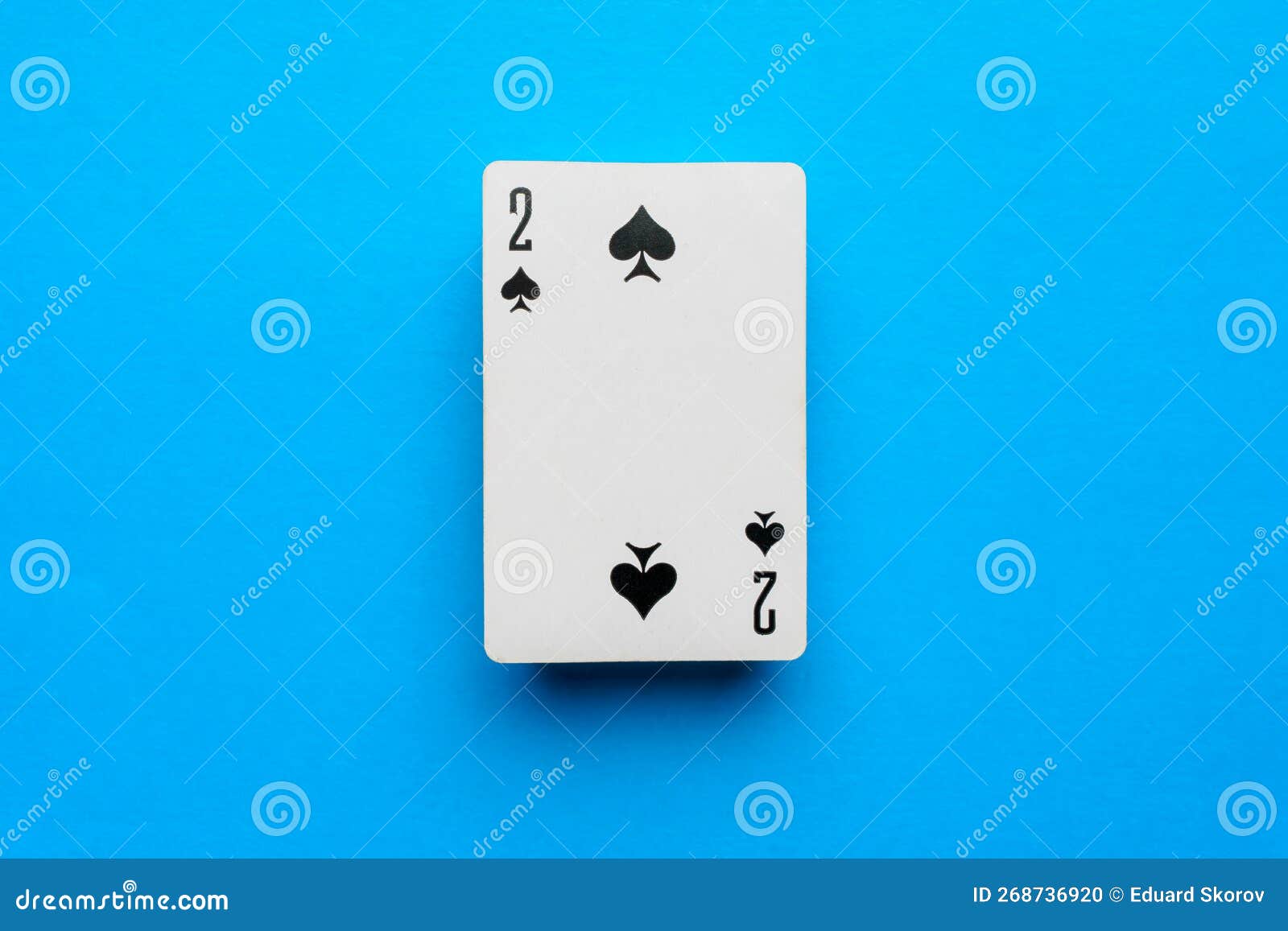 Playing Card Deuce of Spades on a Blue Background Stock Photo - Image ...