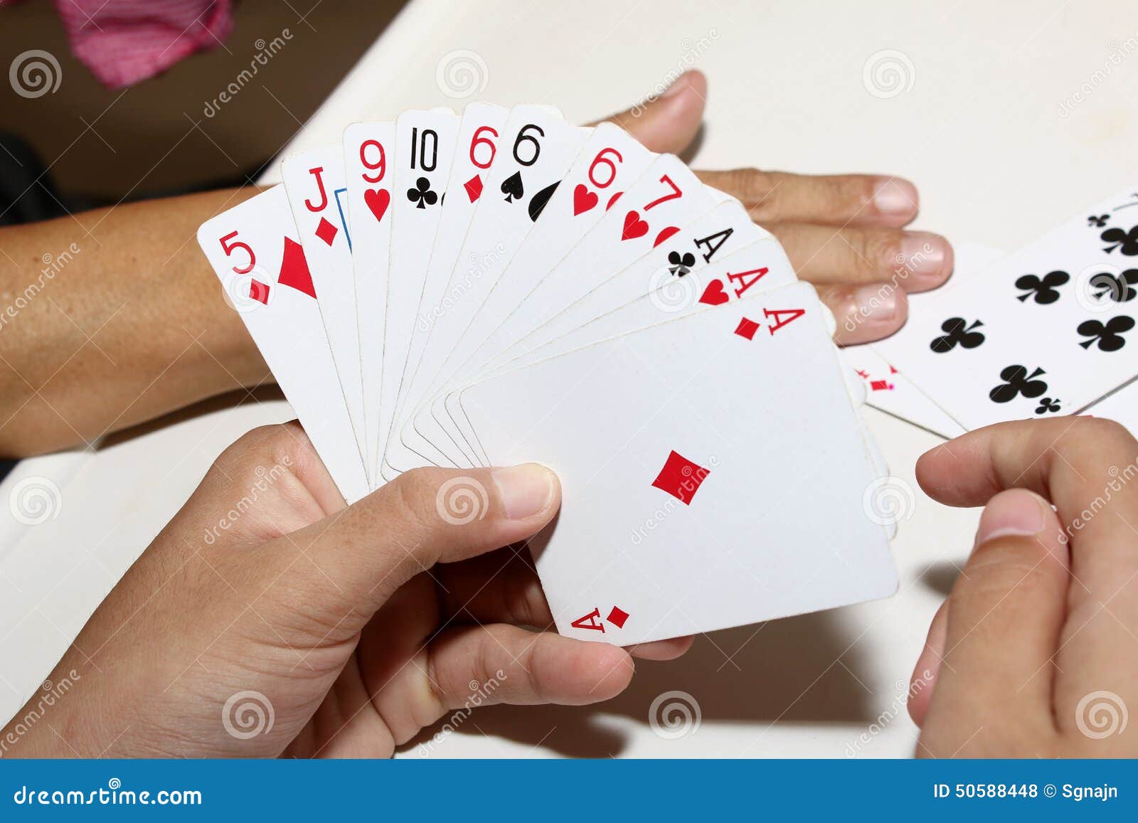 Playing cards in hand stock photo. Image of holding, background - 50588448