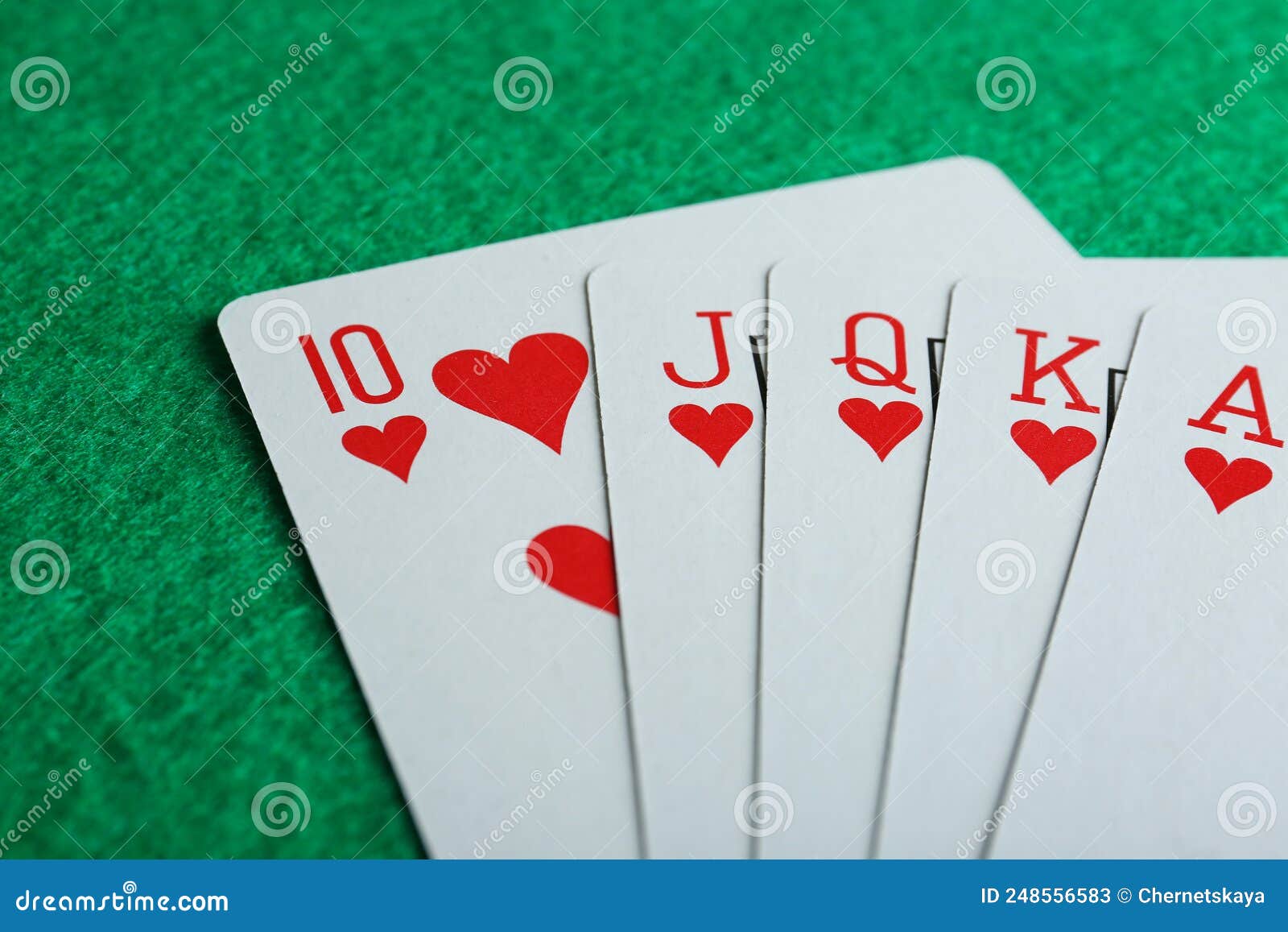 Playing Cards with Royal Flush Combination on Green Table, Closeup ...