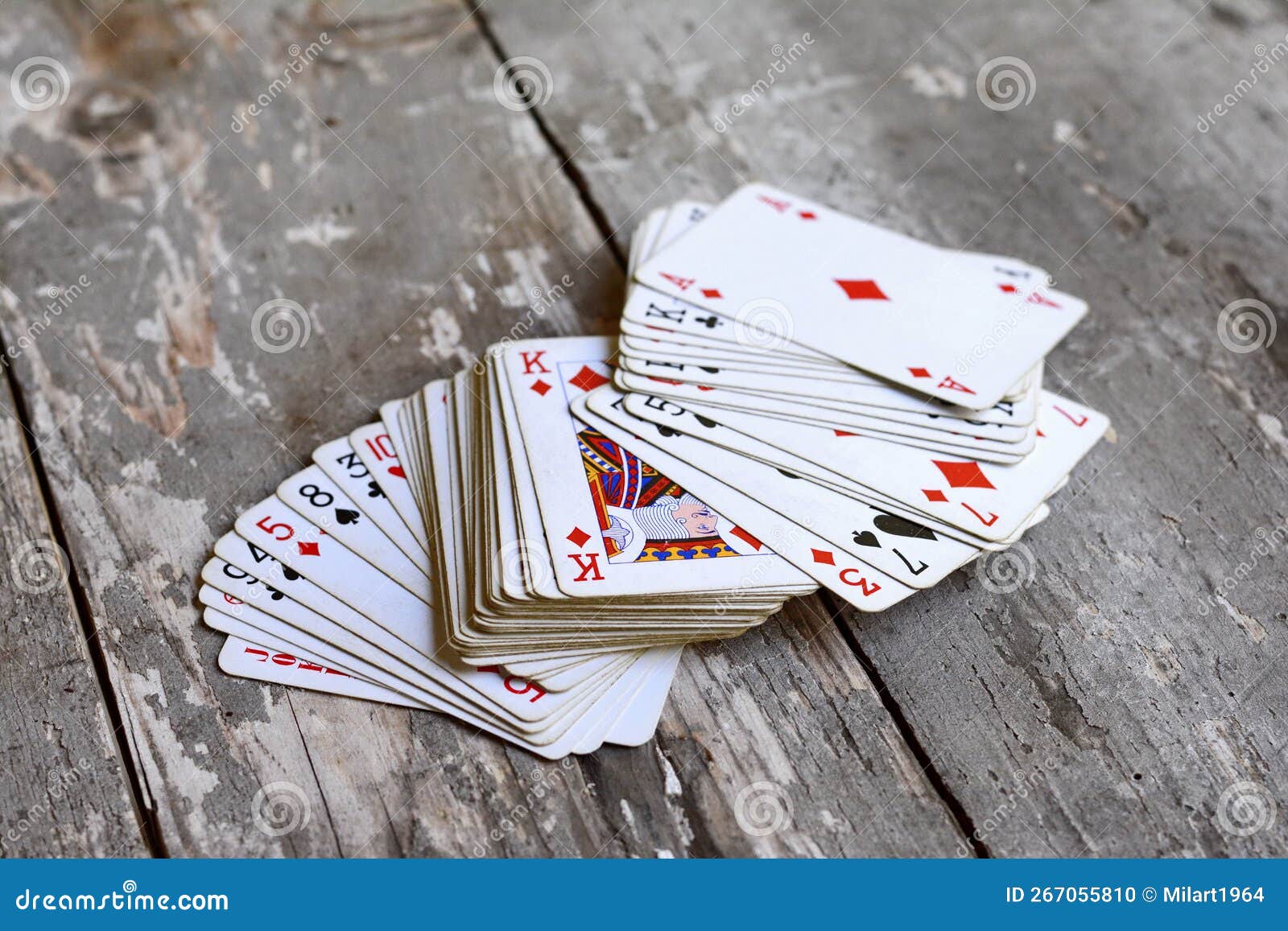 Playing Cards on a Rustic Wooden Table. Stock Photo - Image of hand ...