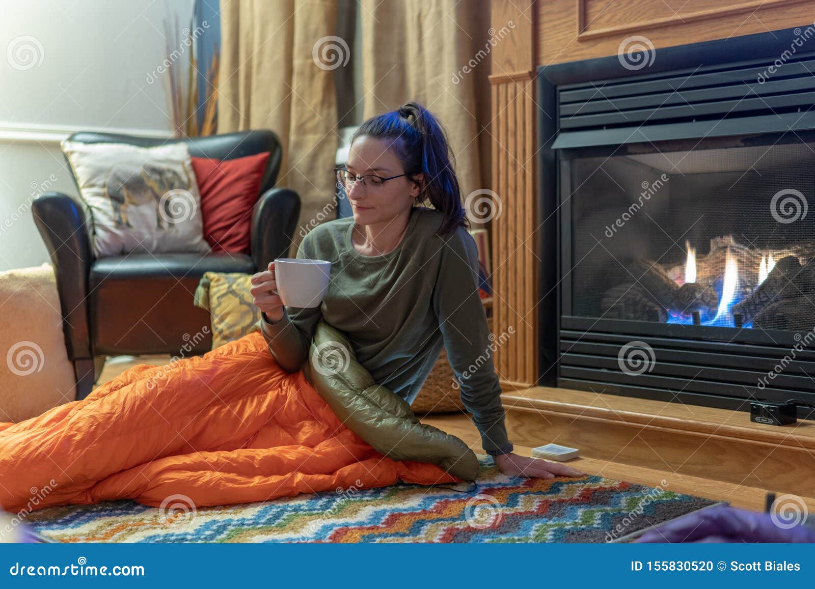 Keeping Warm with Down Blankets by the Fire Stock Photo - Image of ...