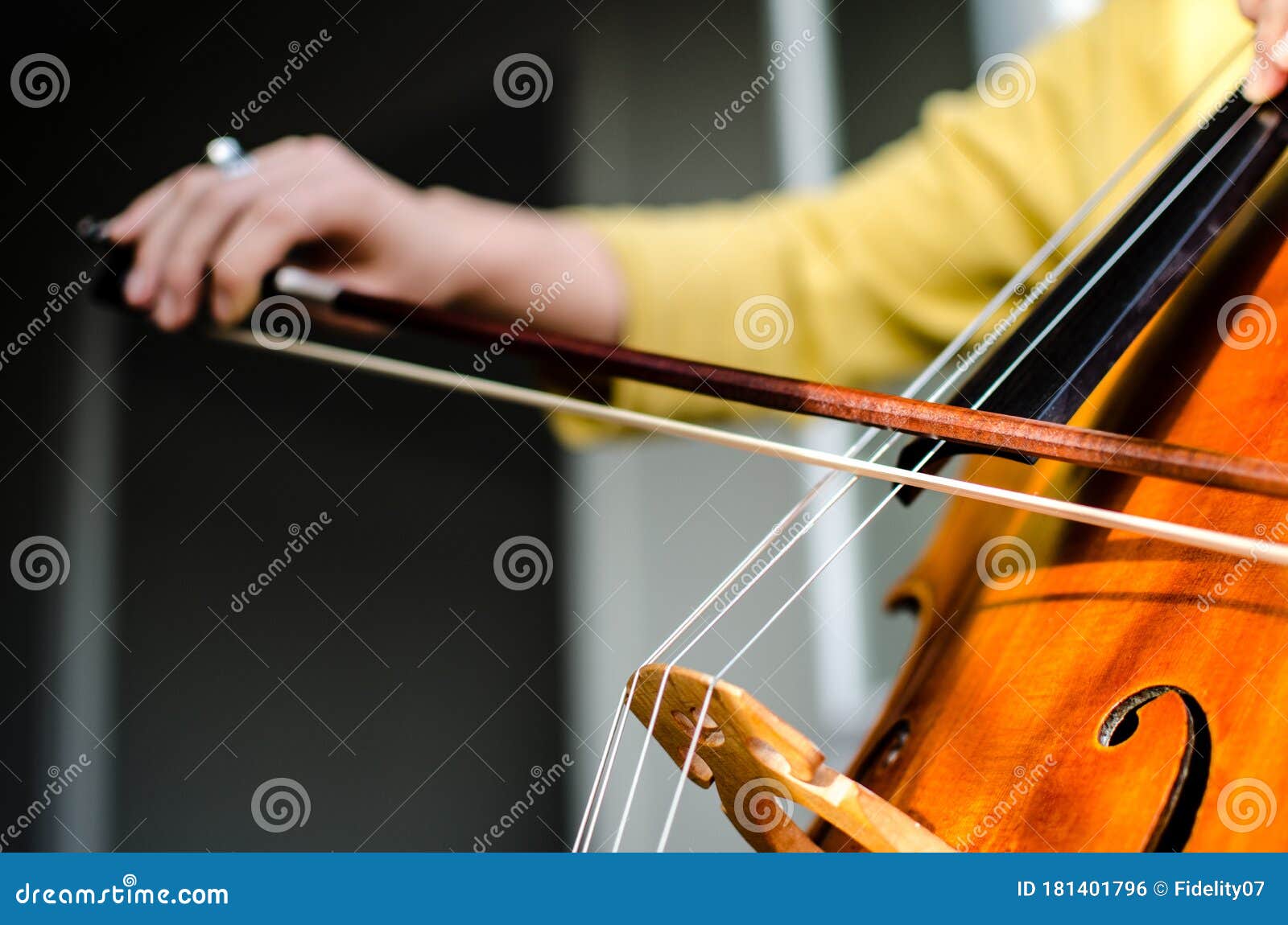 Female Hand Holding Bow while Playing Cello Close-up Stock Photo ...