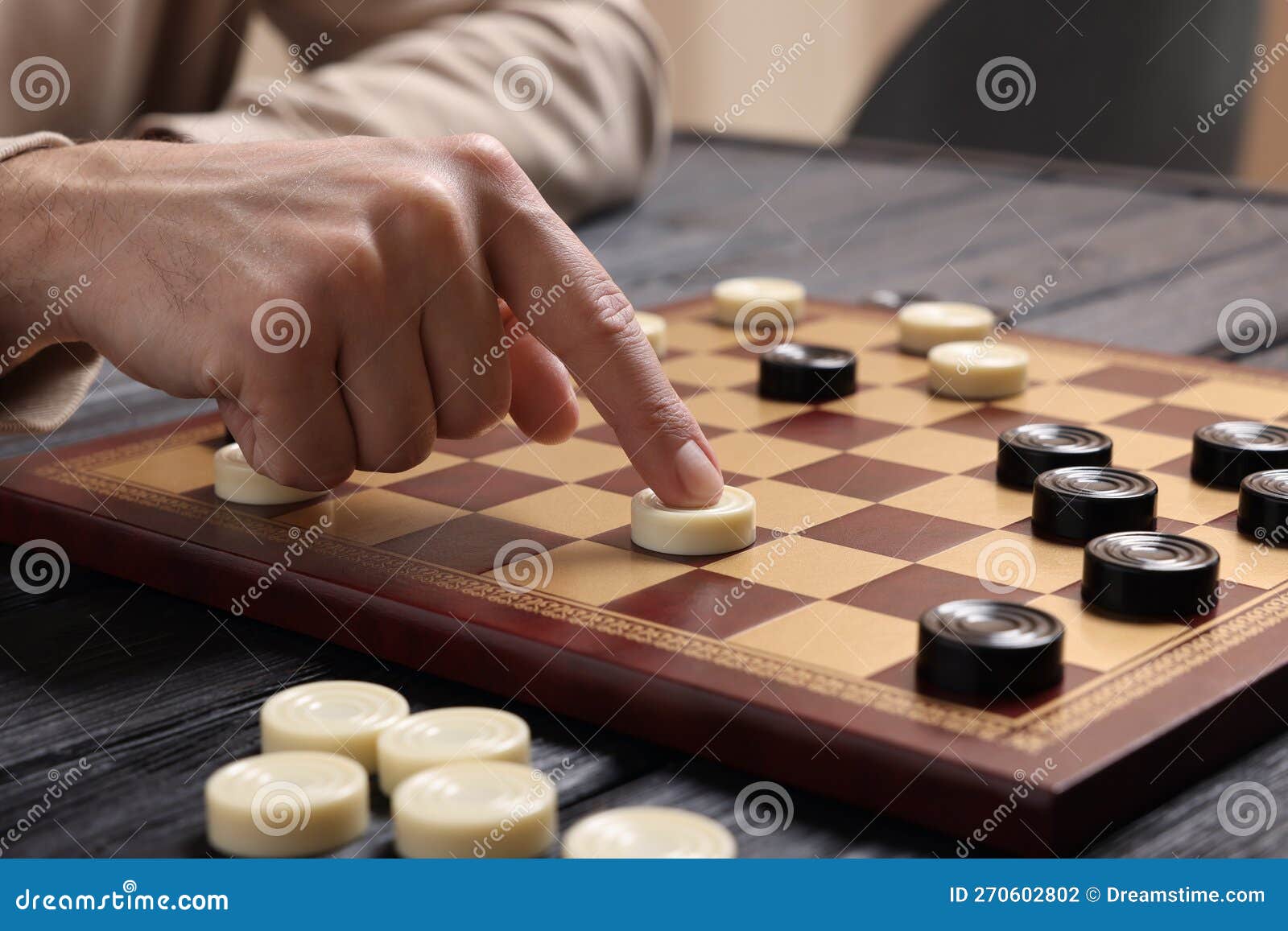 Playing Checkers. Man Thinking about Next Move at Wooden Table, Closeup ...