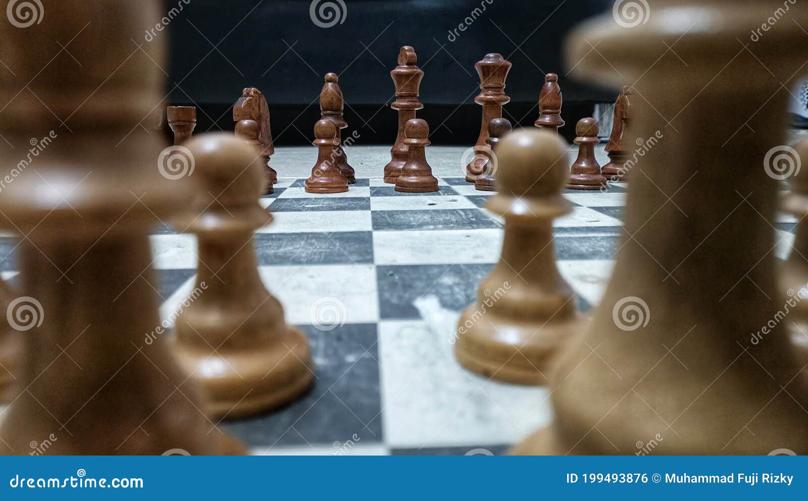 Playing chess with friend stock photo. Image of clothing - 199493876