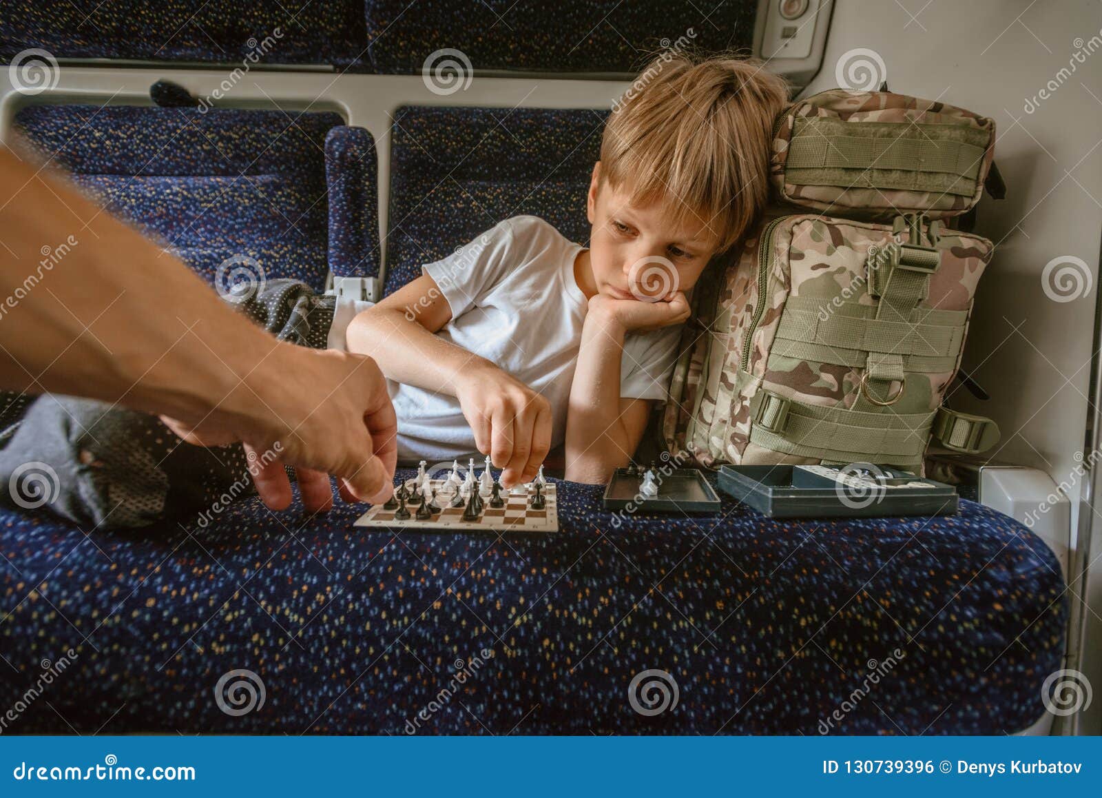 Playing chess in train stock photo. Image of portrait - 130739396