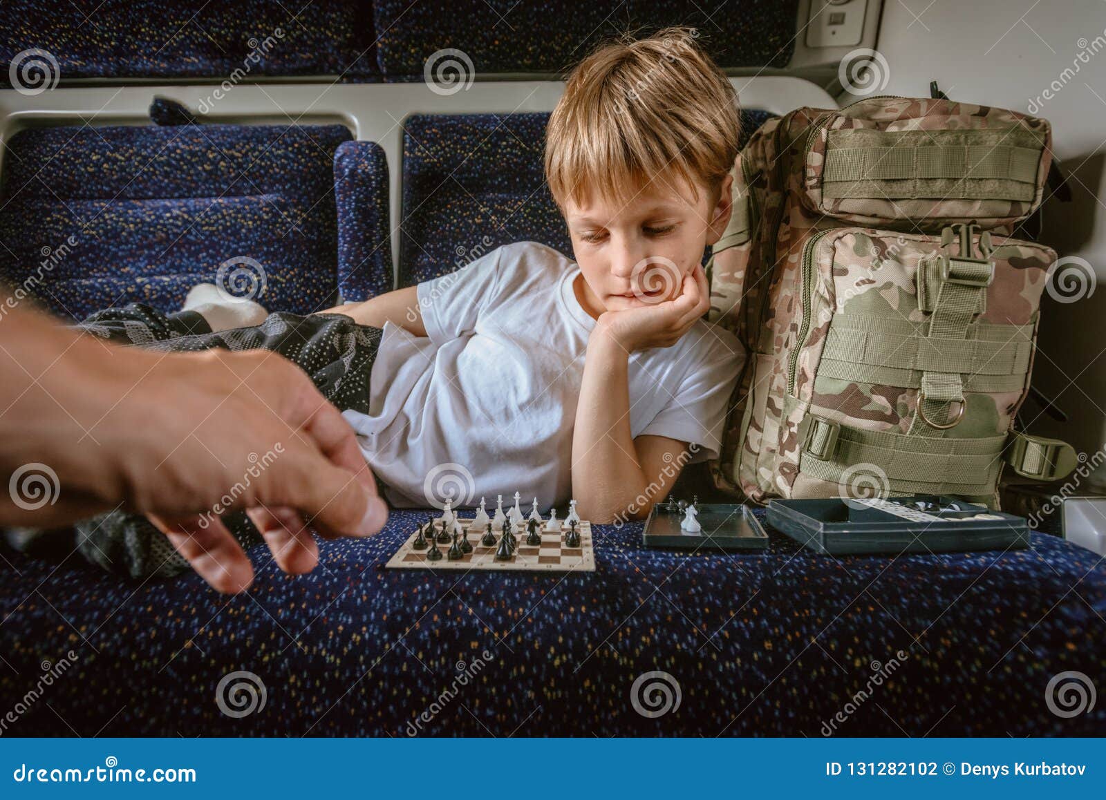 Playing chess in train stock photo. Image of teenager - 131282102