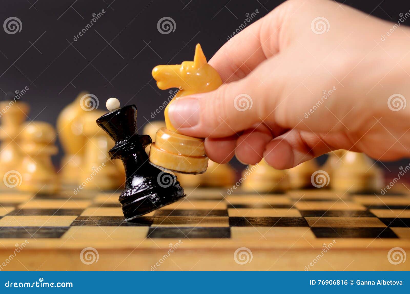 Playing Chess. White Knight Hitting the Black Queen in Front of the ...