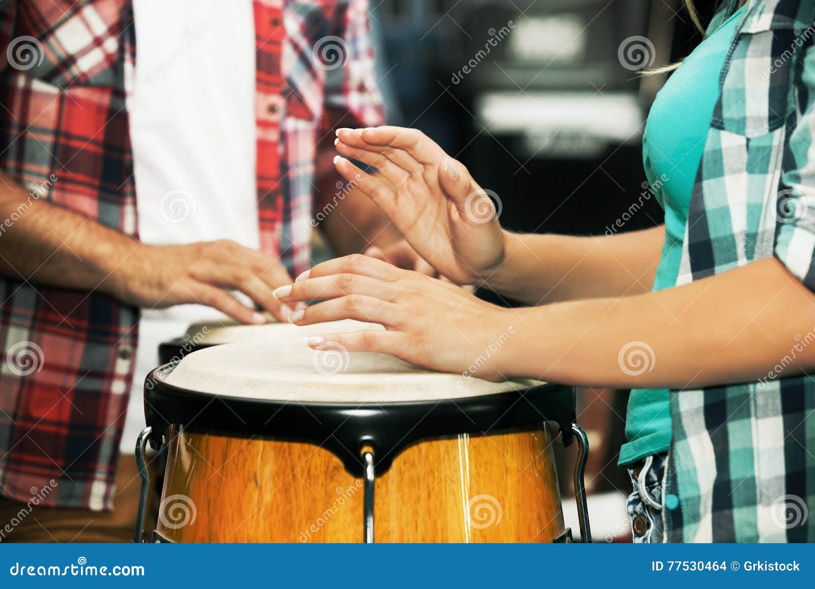 Playing congas. Close up. stock photo. Image of woman - 77530464