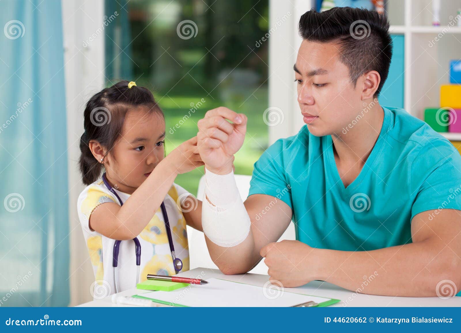 Playing Doctor during Medical Appointment Stock Photo - Image of care ...