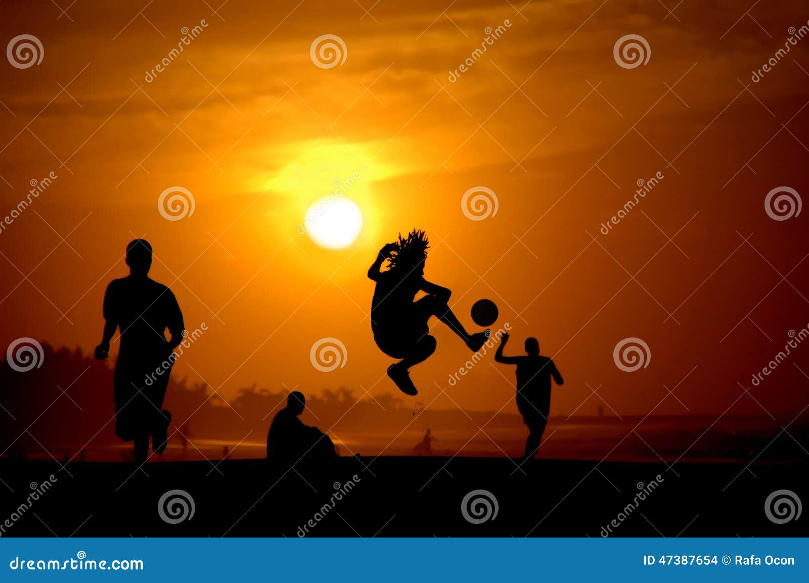 Playing Footbal at the Sunset on the Beach Stock Photo - Image of ...