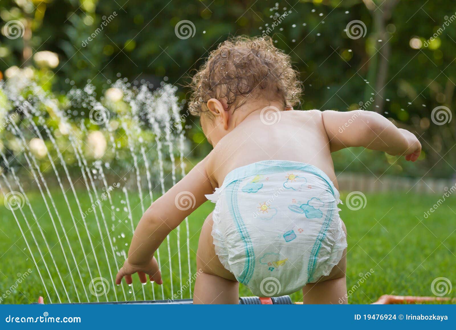 Playing with Garden Sprinkler Stock Photo - Image of water, young: 19476924