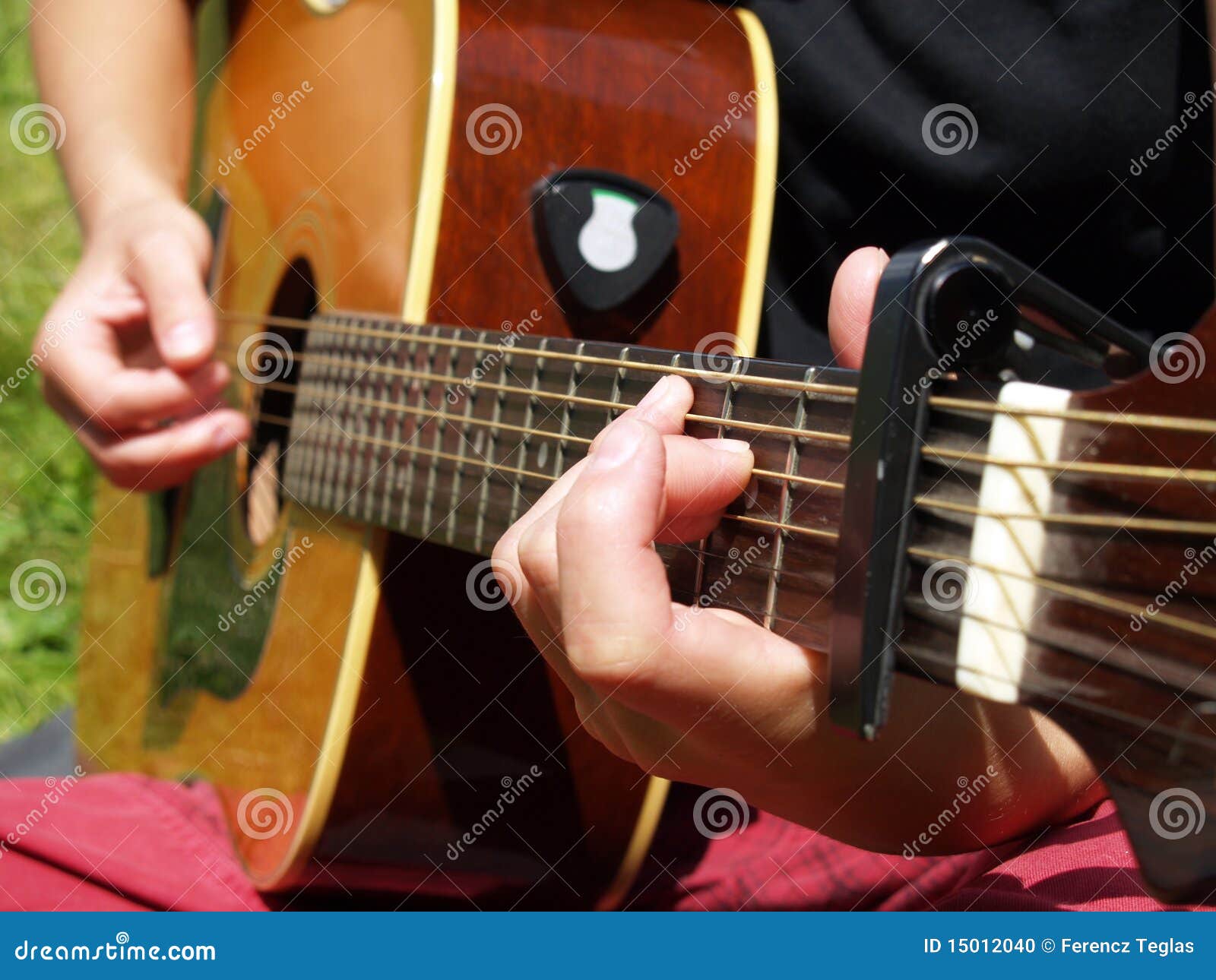 Playing the guitar outdoor stock photo. Image of instrument - 15012040