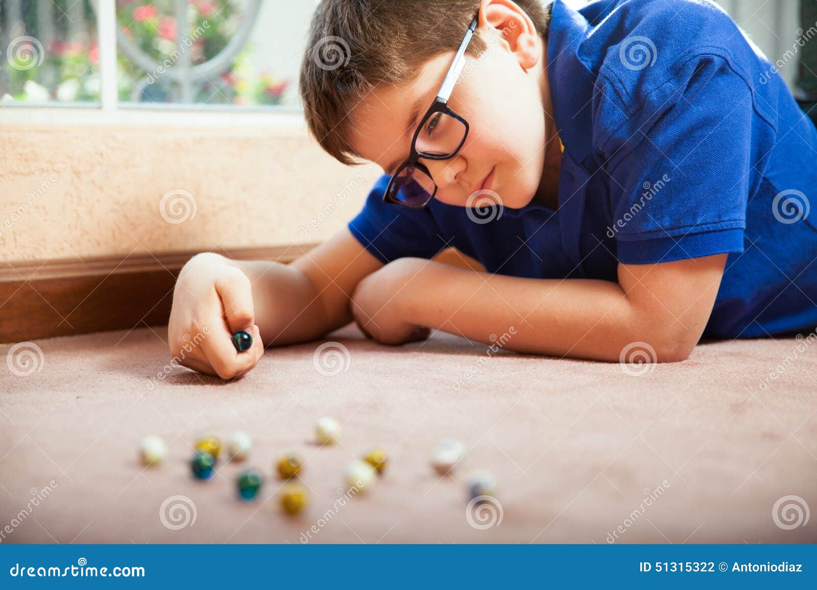 Playing with Marbles at Home Stock Photo - Image of home, cute: 51315322