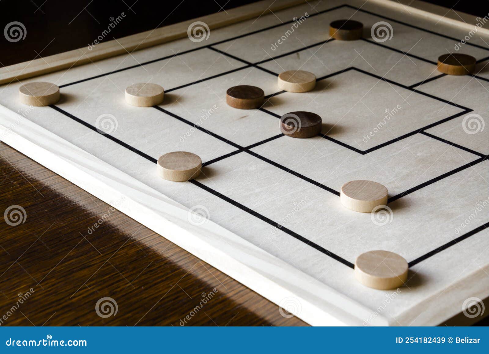 Playing Mill Game on a Wooden Table Stock Image - Image of playing ...