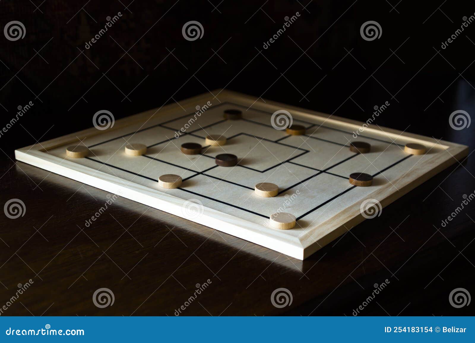 Playing Mill Game on a Wooden Table Stock Photo - Image of table ...