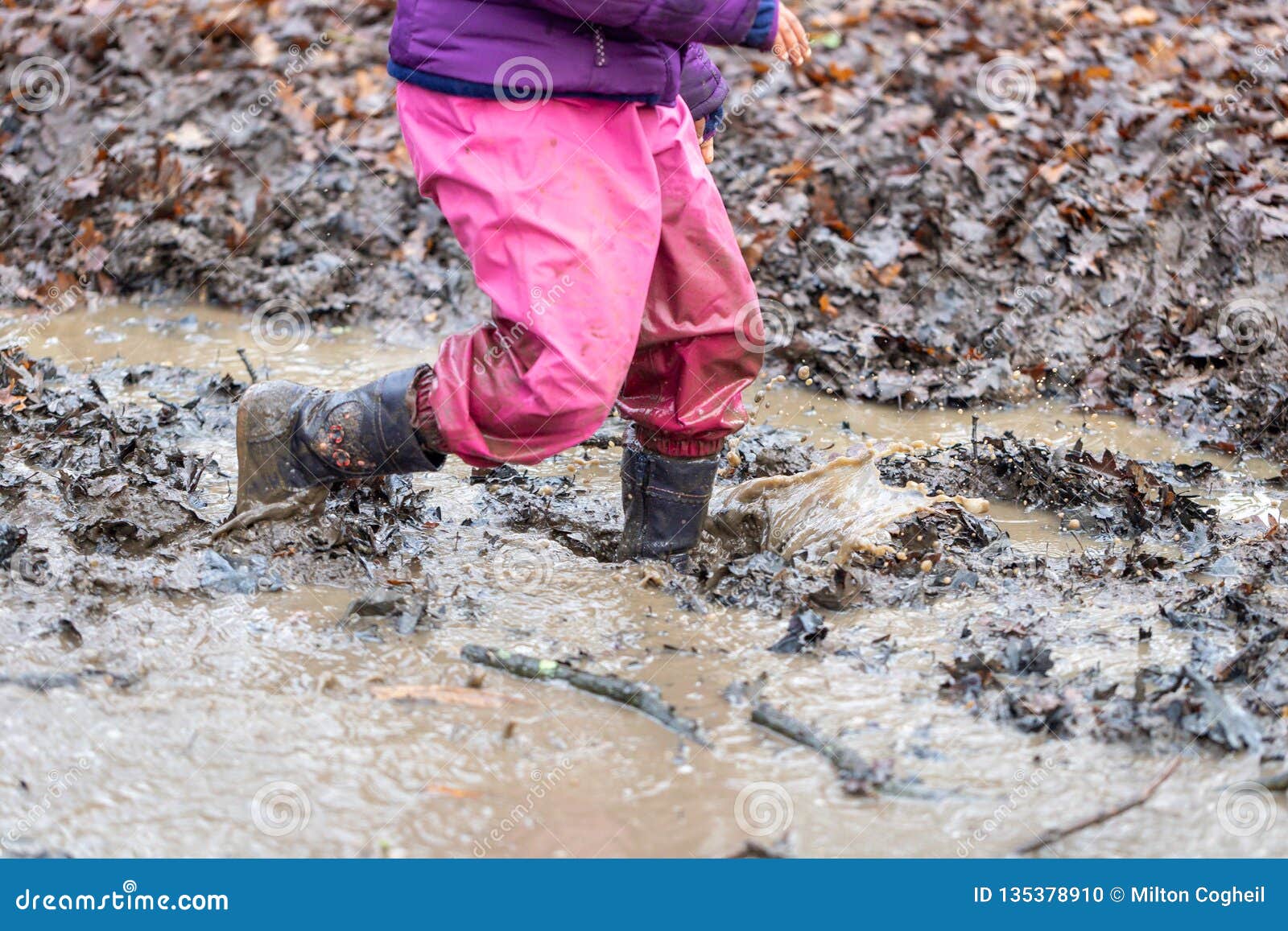 Playing in Mud stock photo. Image of oute, jump, child - 135378910