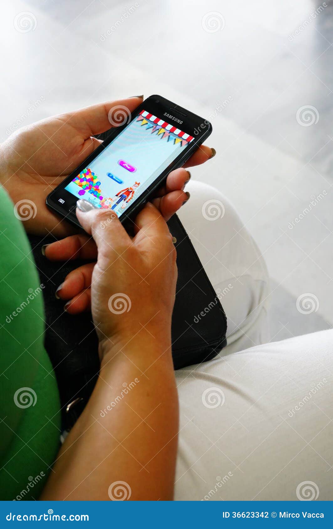 Playing phone games editorial photography. Image of touch - 36623342